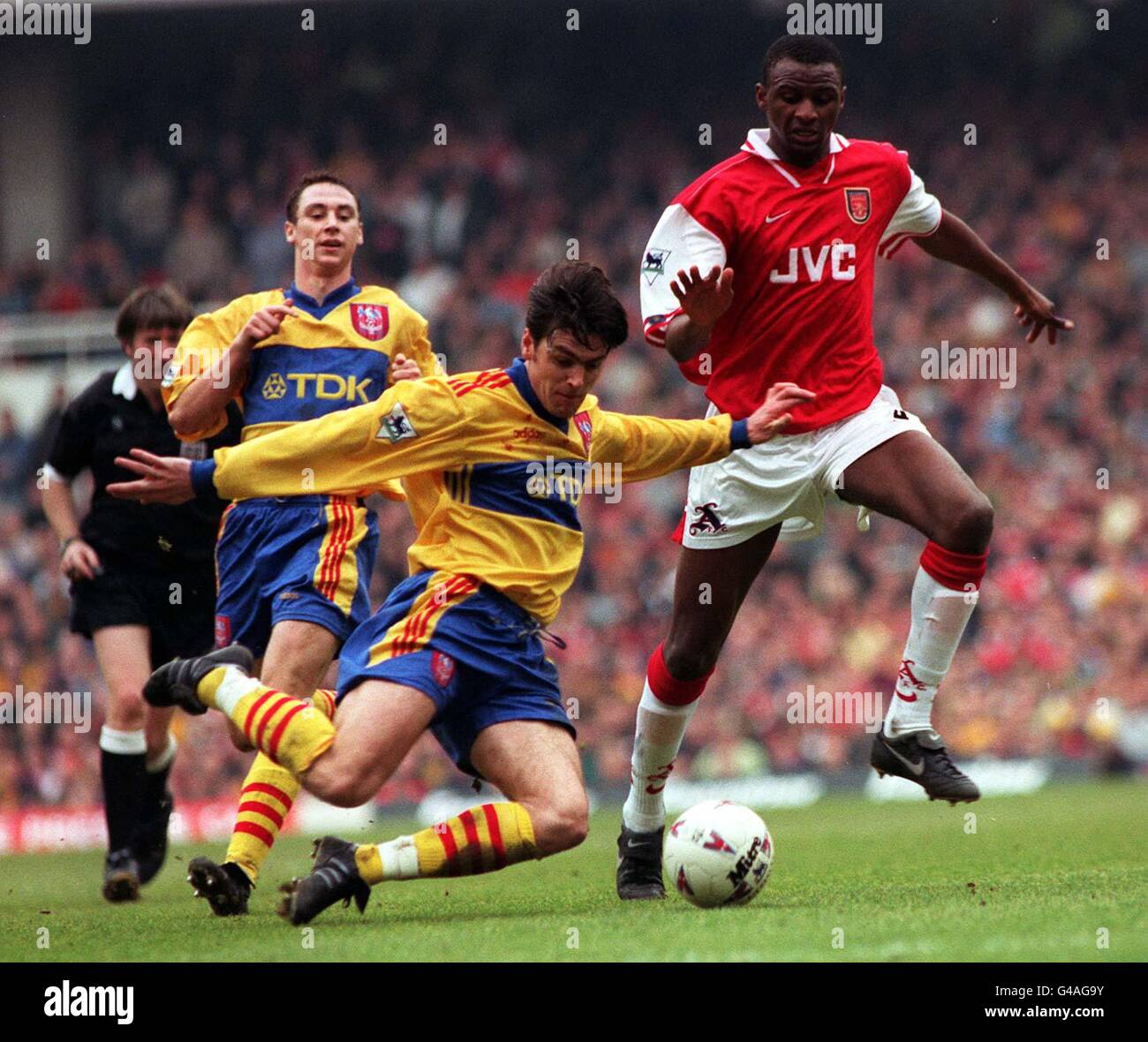 Crystal Palace's Marc Edworthy (front, left) steals the ball from ...