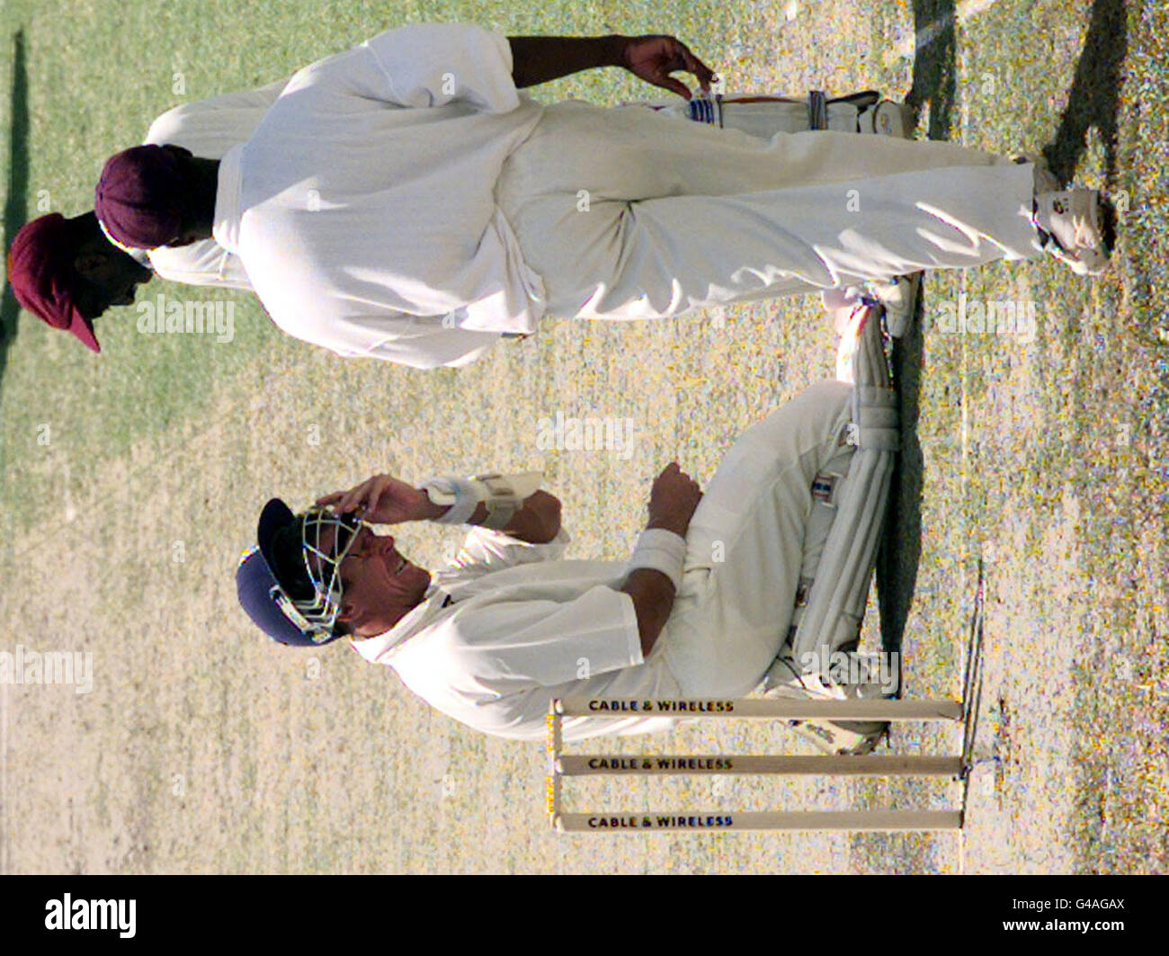 England's Alec Stewart is hit in the box by West Indian bowler Kenny ...