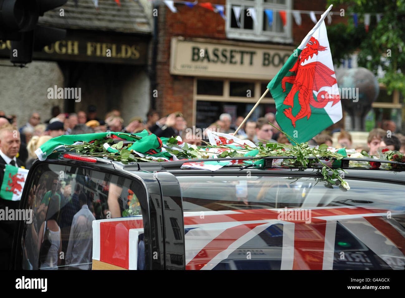 A flag is placed on the hearse during the repatriation of Royal Marine ...