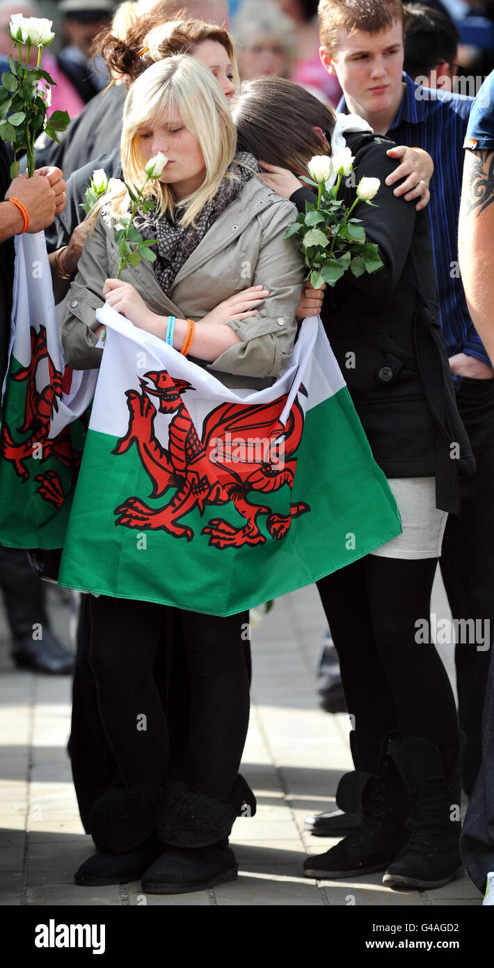Mourners with the Welsh flag pictured during the repatriation of Royal ...