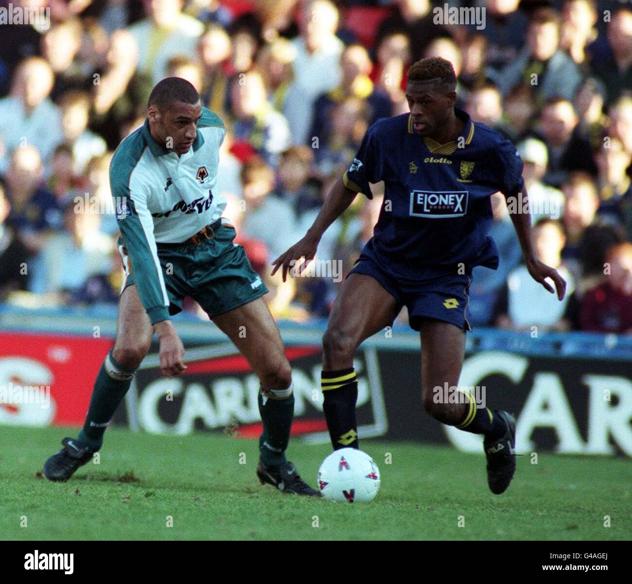 Wolverhampton's Dean Richards (left) battles for possession with ...
