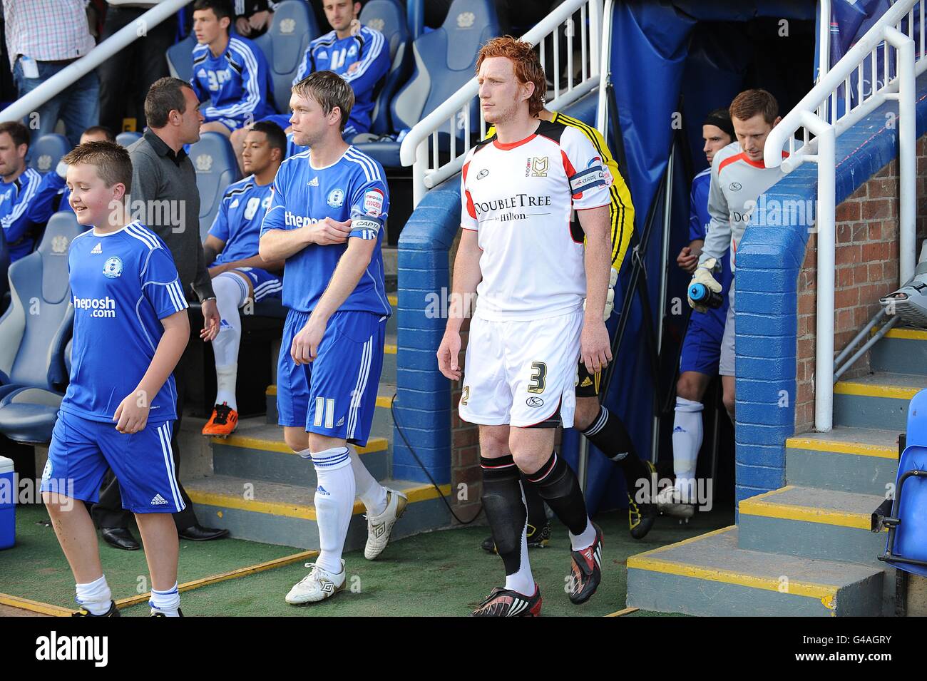Peterborough United captain Grant McCann and Milton Keynes Dons captain ...