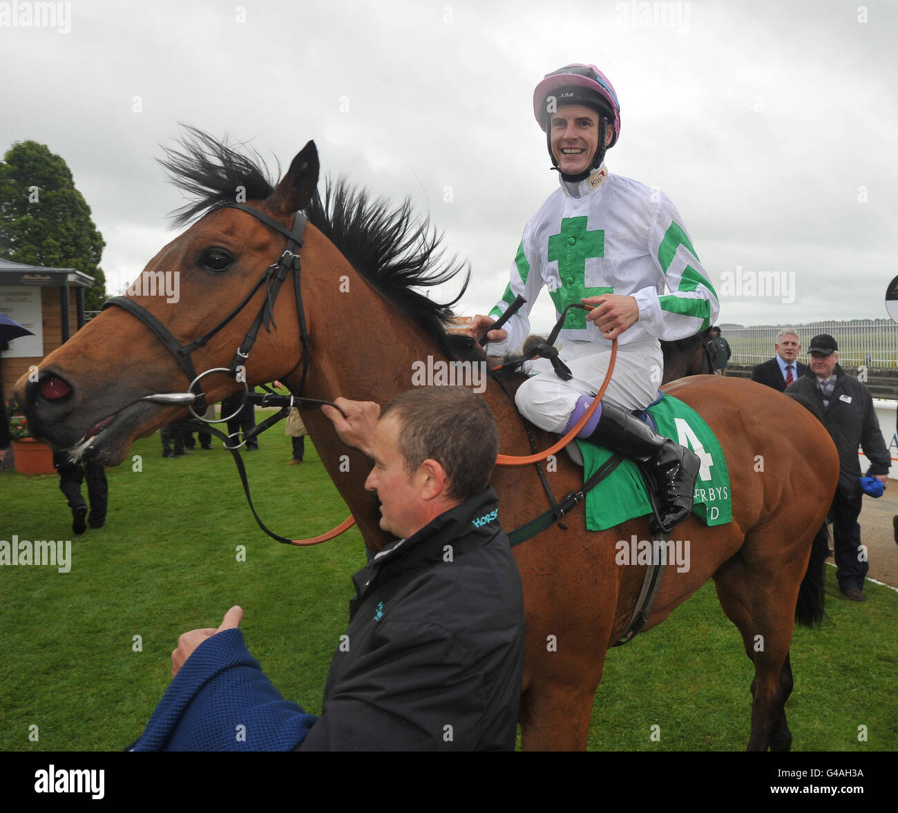 Hitchens with jockey Fran Berry enters the winners enclosure after ...