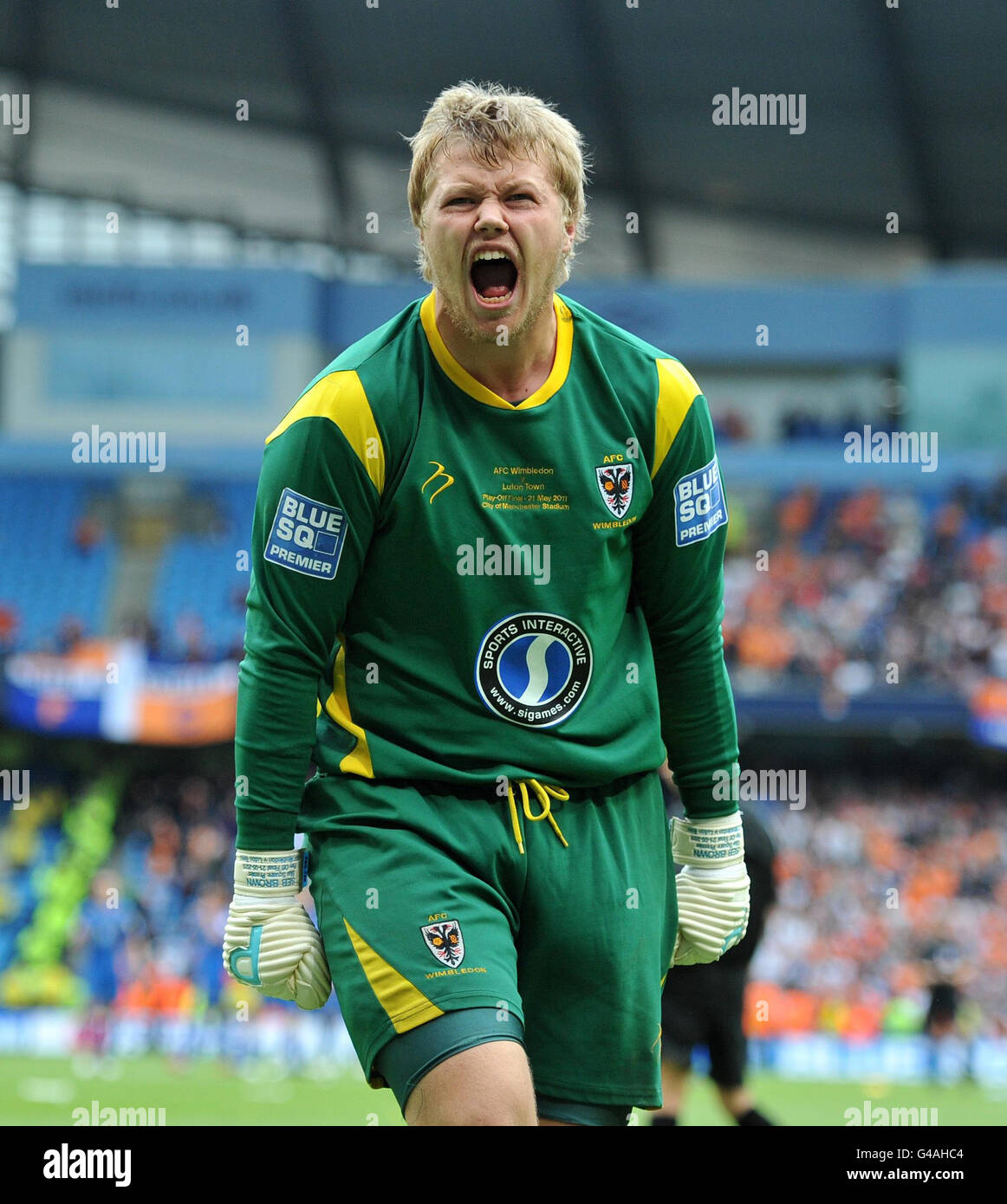 AFC Wimbledon's Seb Brown celebrates his sides victory and promotion ...