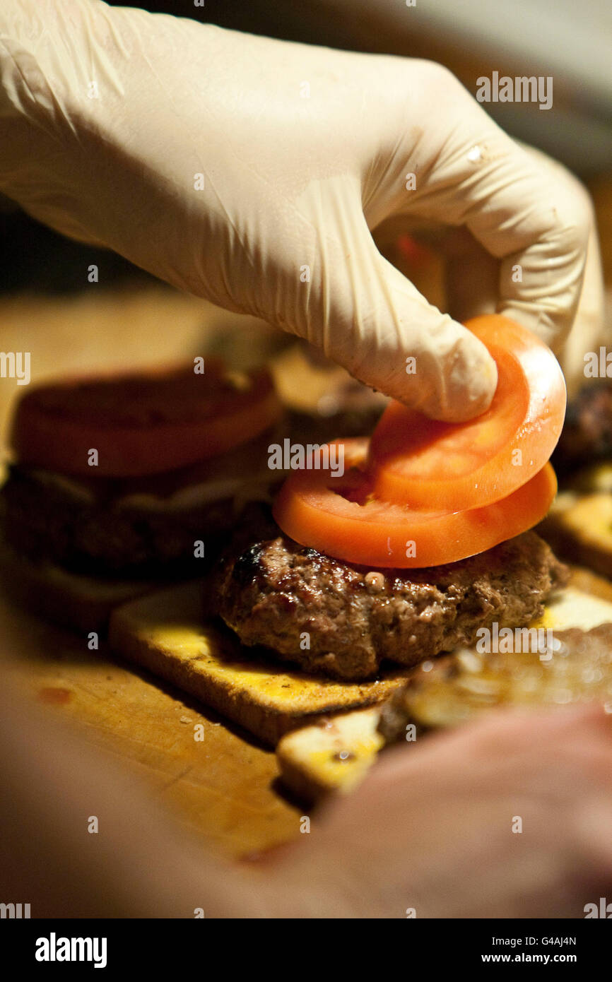 Jeff Lassen, Louis' great grandson, prepares hamburgers at Louis' Lunch ...