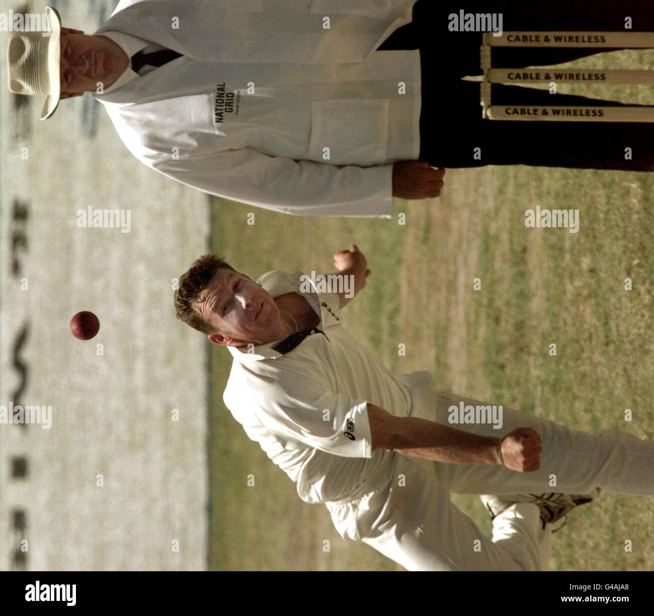 England spin bowler Robert Croft in action with umpire Darryl Hare ...