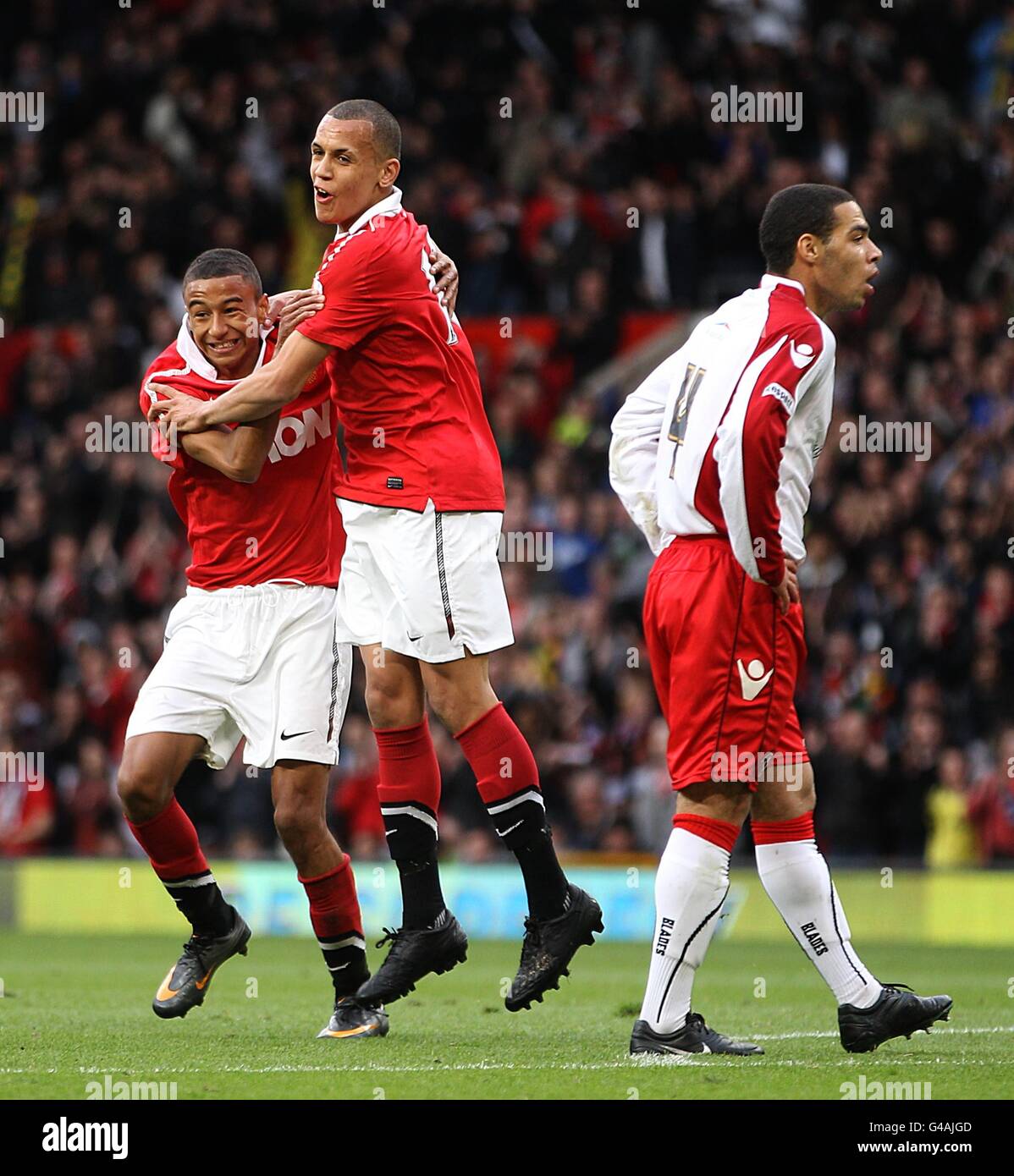 Manchester United's Ravel Morisson (centre) celebrates with team mate ...