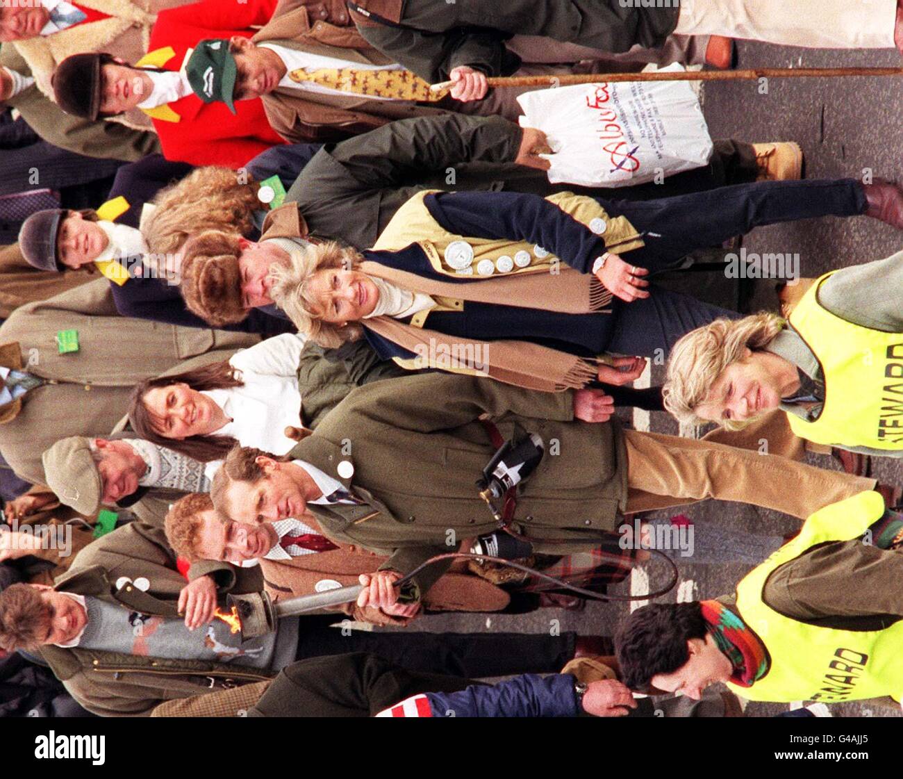 Richard Meade carries the torch with Lucinda Green and other supporters ...