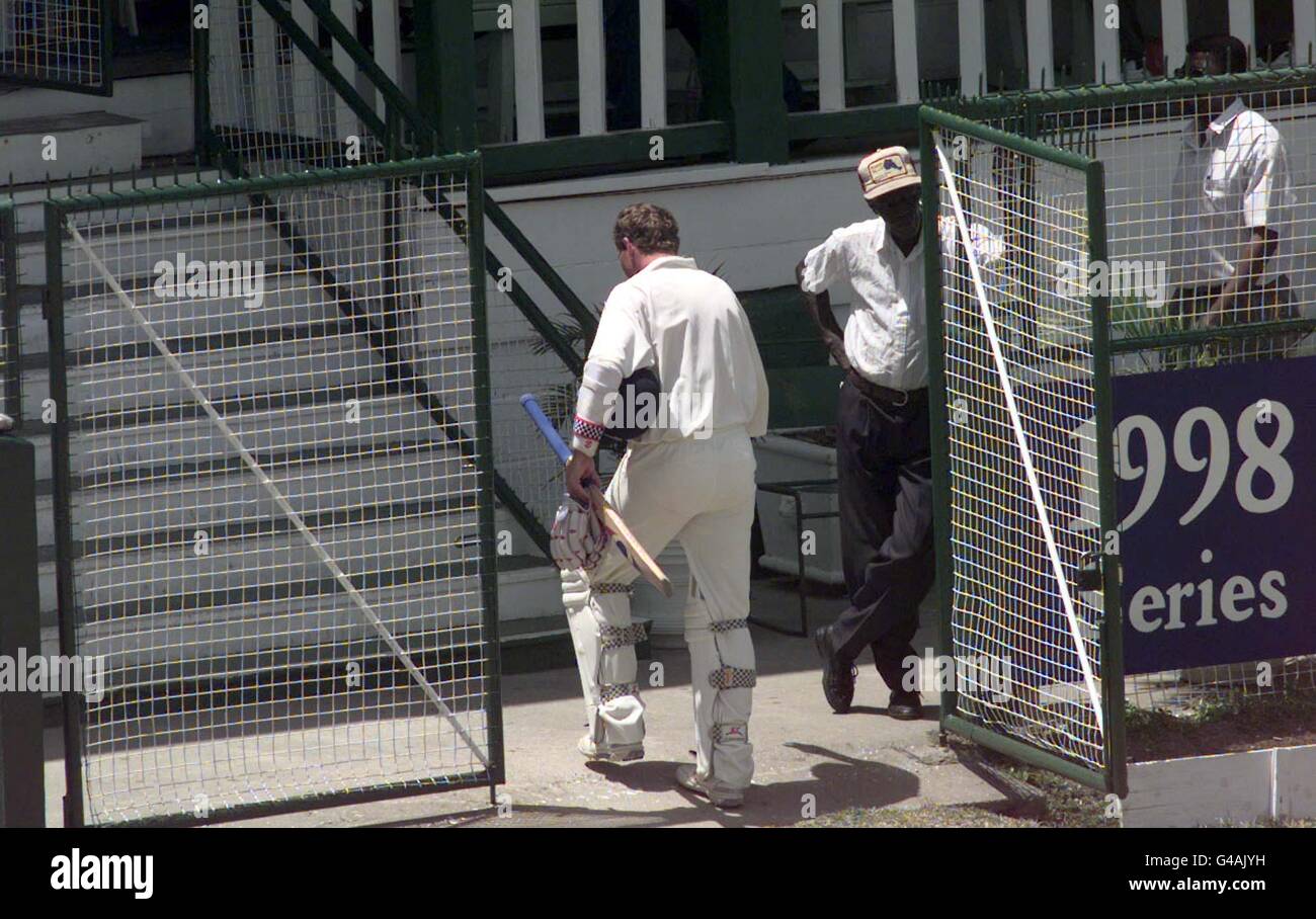 England captain Michael Atherton returns to the pavilion after being ...