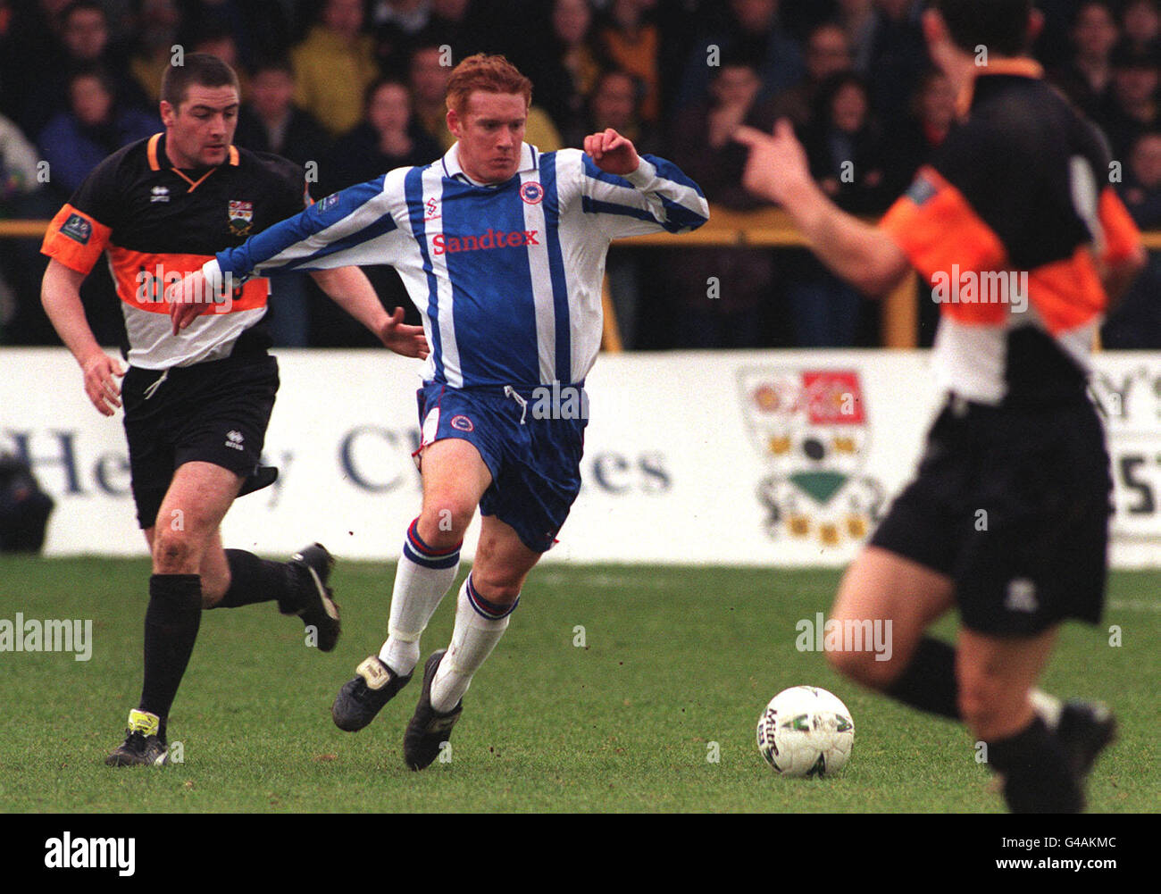 John Doolan of Barnet chases Brighton's Kerry Mayo during their ...