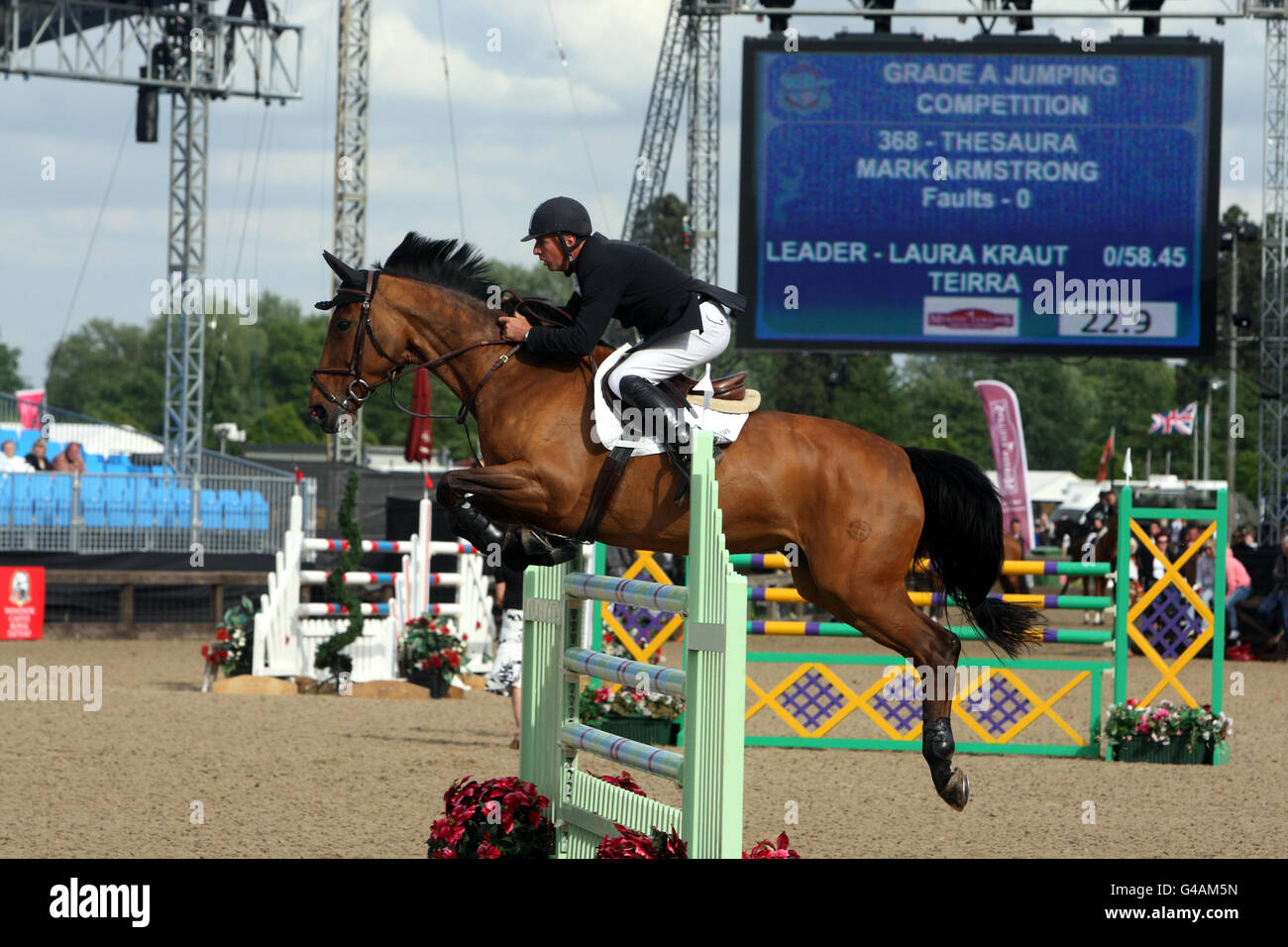 Mark Armstrong riding Thesaura competes in a jumping competition during ...