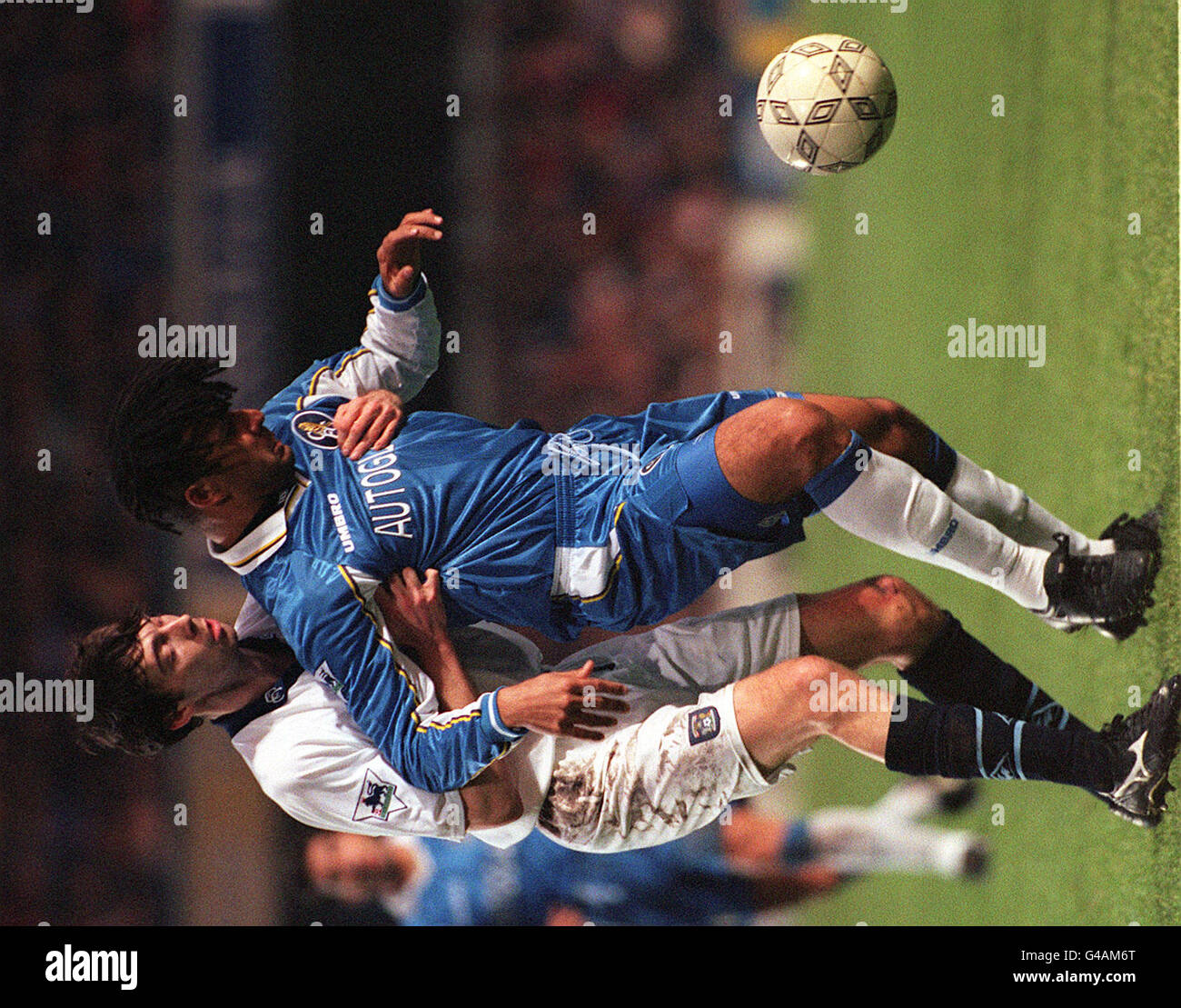Chelsea's Ruud Gillit shields the ball from Coventry City's Gary Breen ...