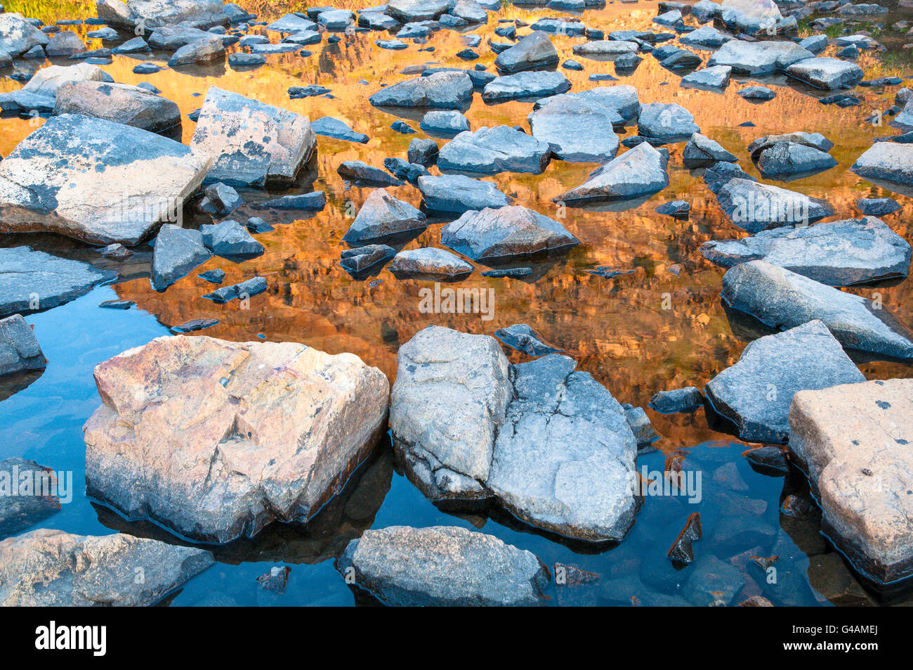 Boulders in pond with reflection, Cathedral Provincial Park,British ...