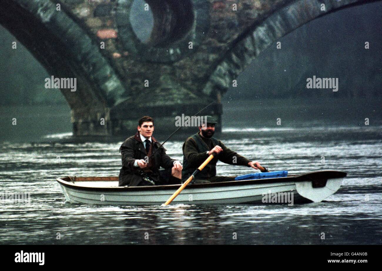 Scotland's rugby Captain Rob Wainwright tackles a slippery opponent on ...