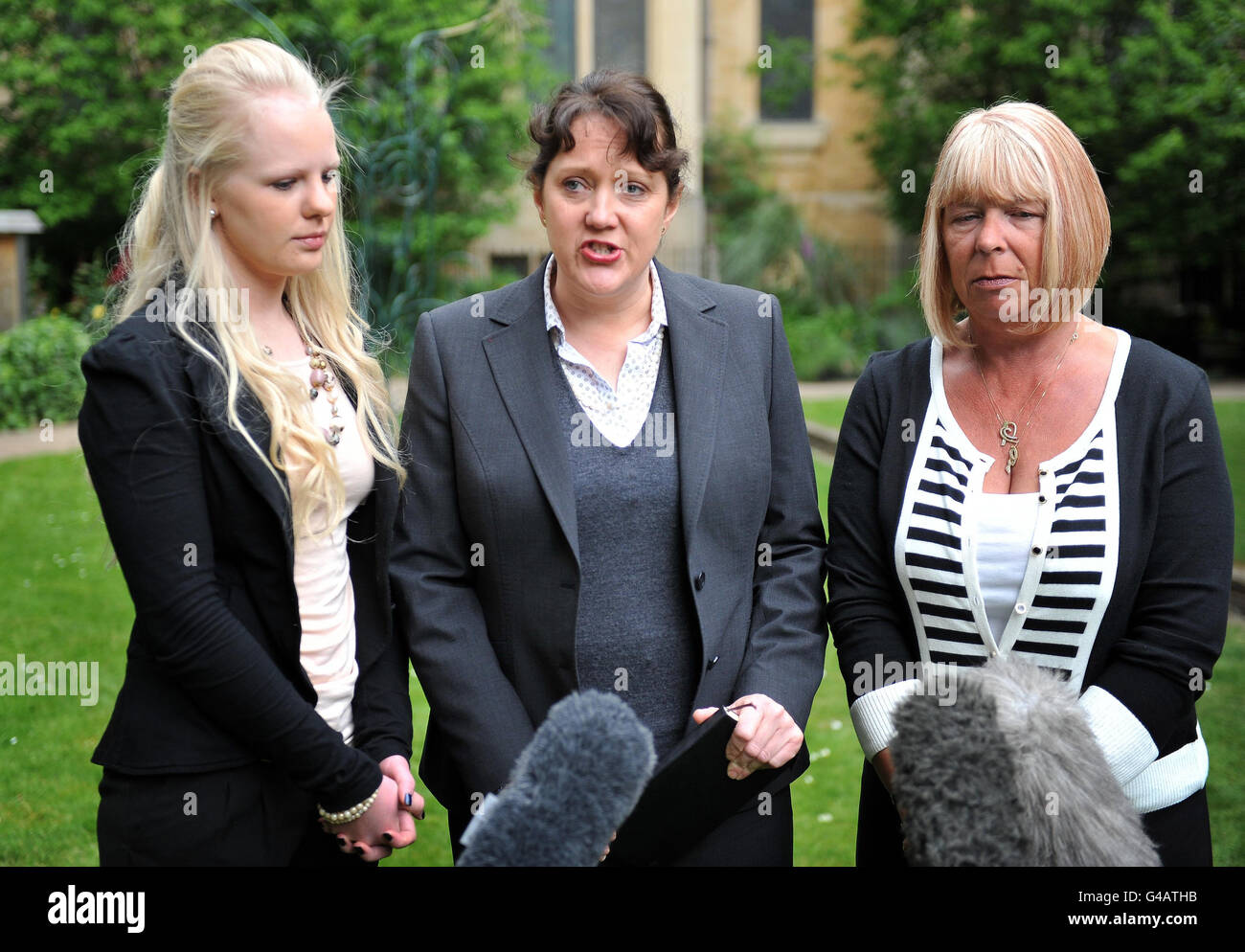 Lt Col Debbie Poneskis (centre) of the Royal Military Police, reads a ...