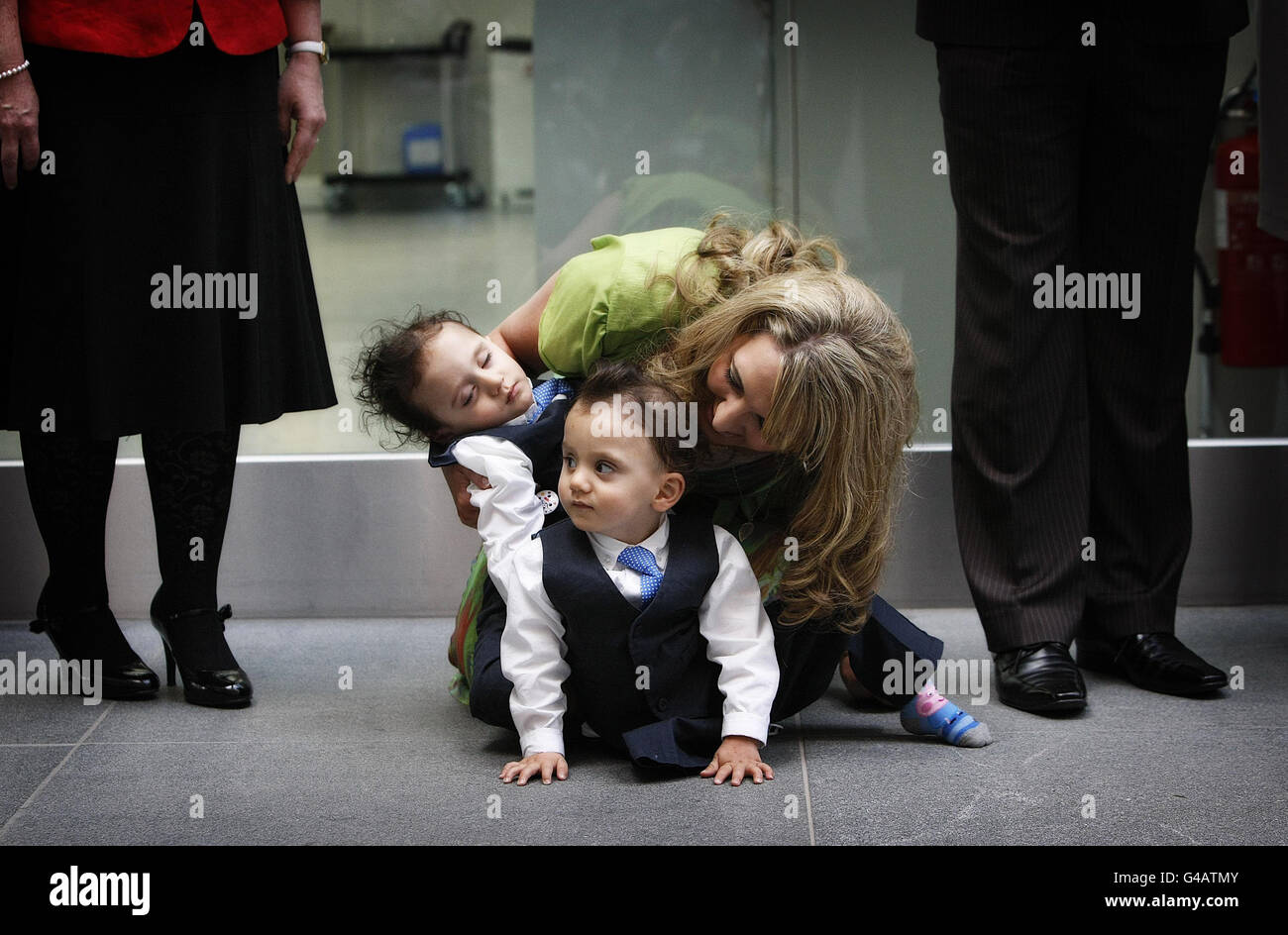Conjoined twins Hassan (left) and Hussein Benhaffaf wait with their ...