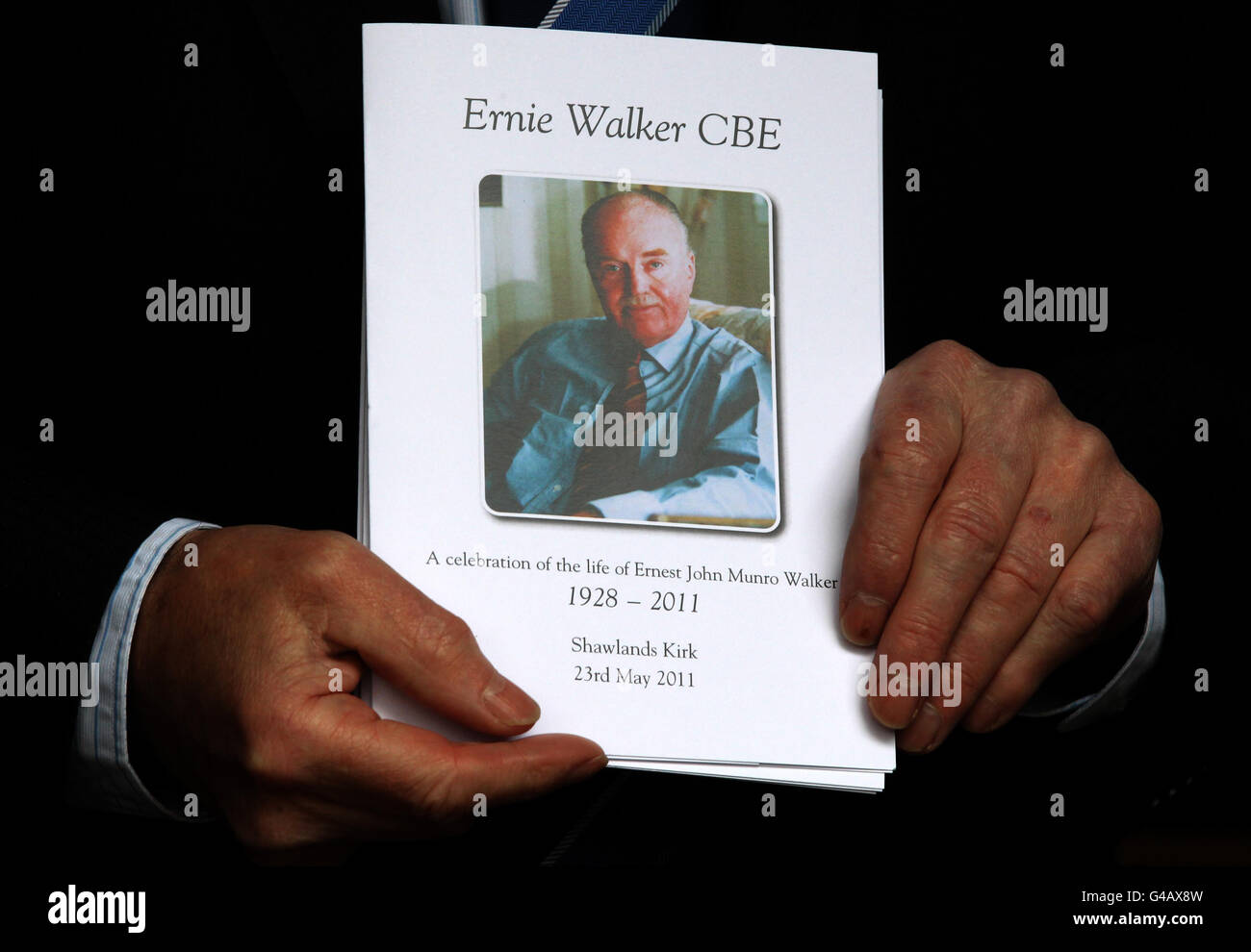 The order of service is held during a memorial service for former ...