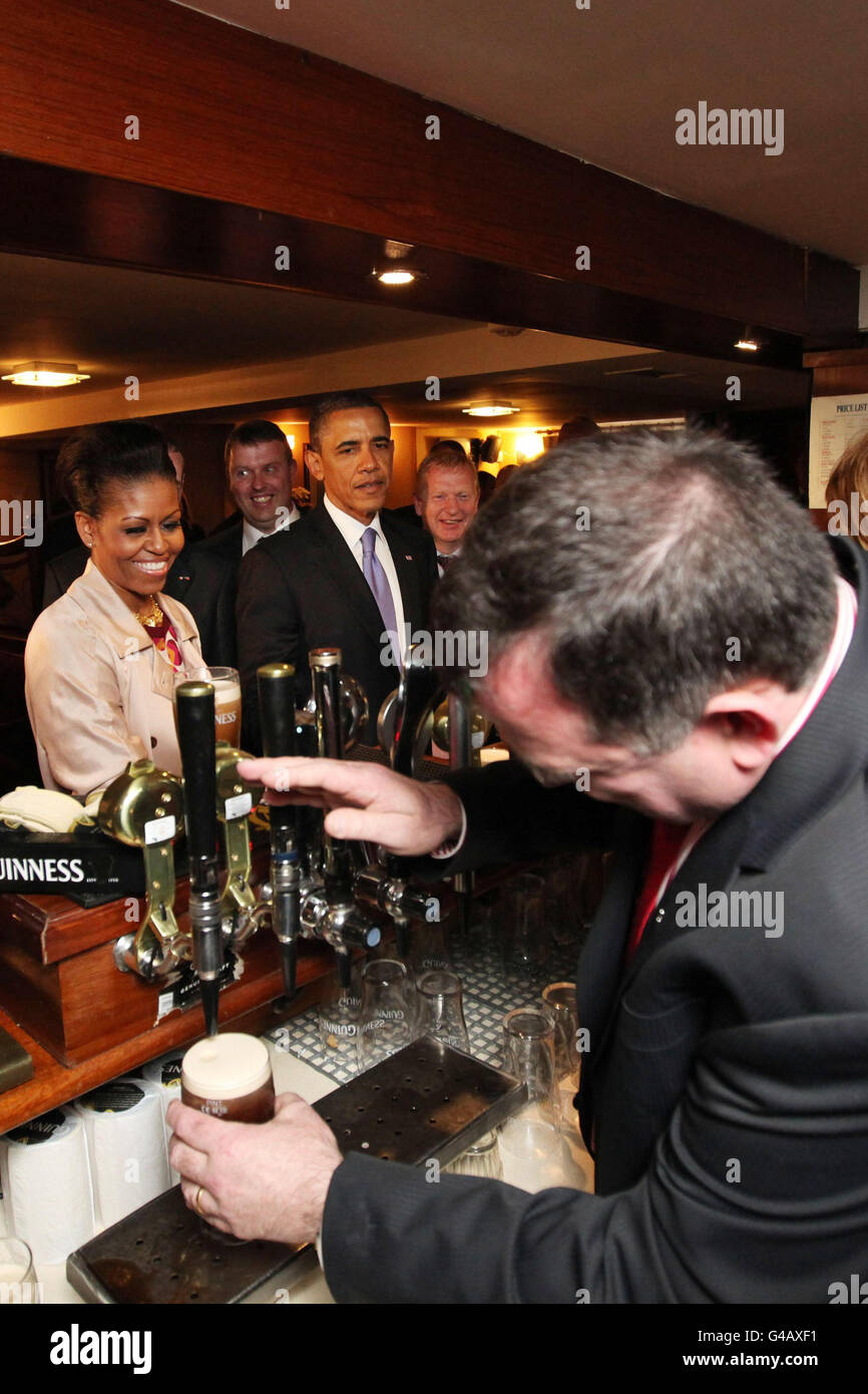 US President Barack Obama and First Lady Michelle Obama enjoying a ...