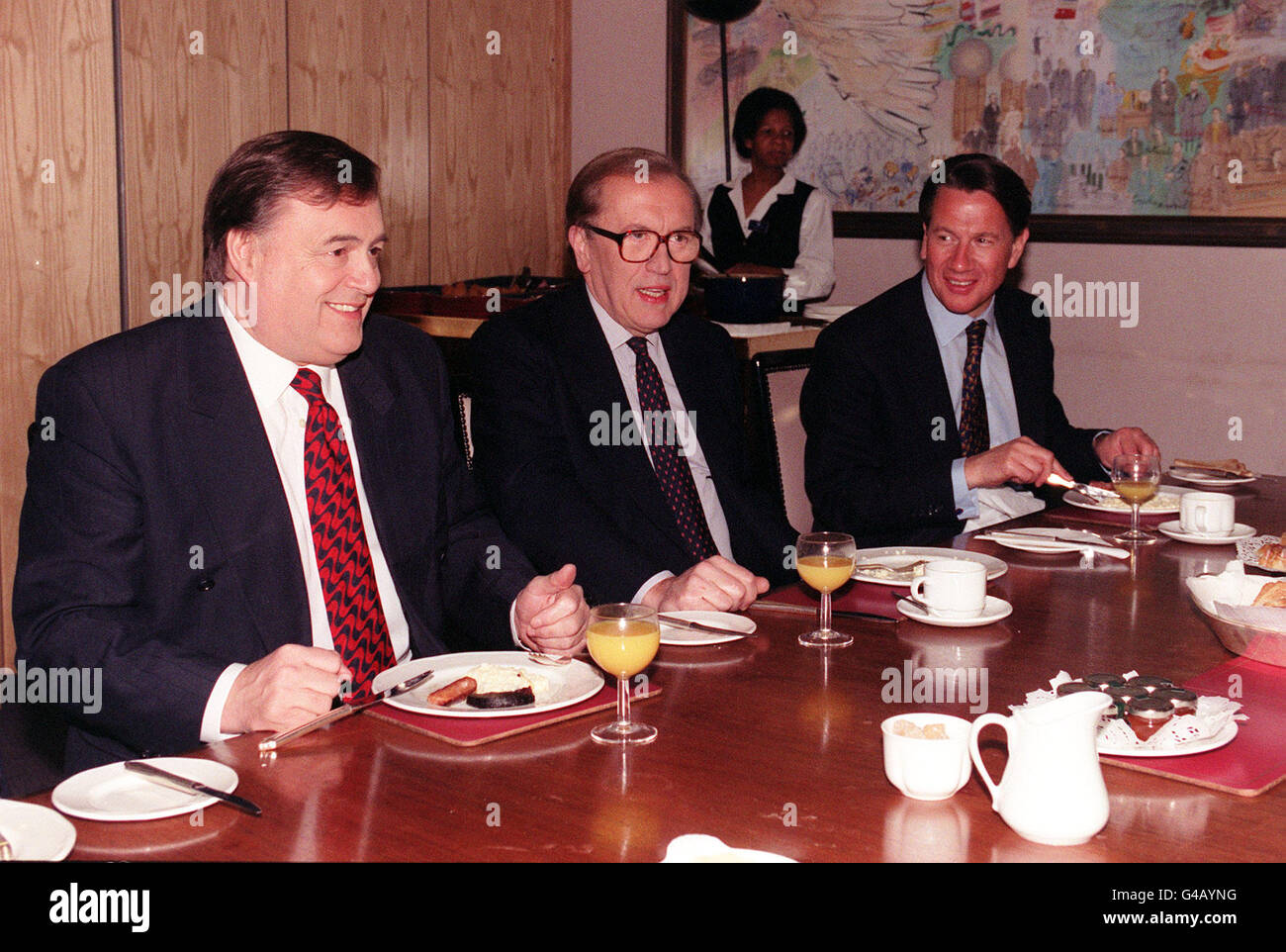 Sir David Frost (centre) is flanked by Deputy Prime Minister John ...
