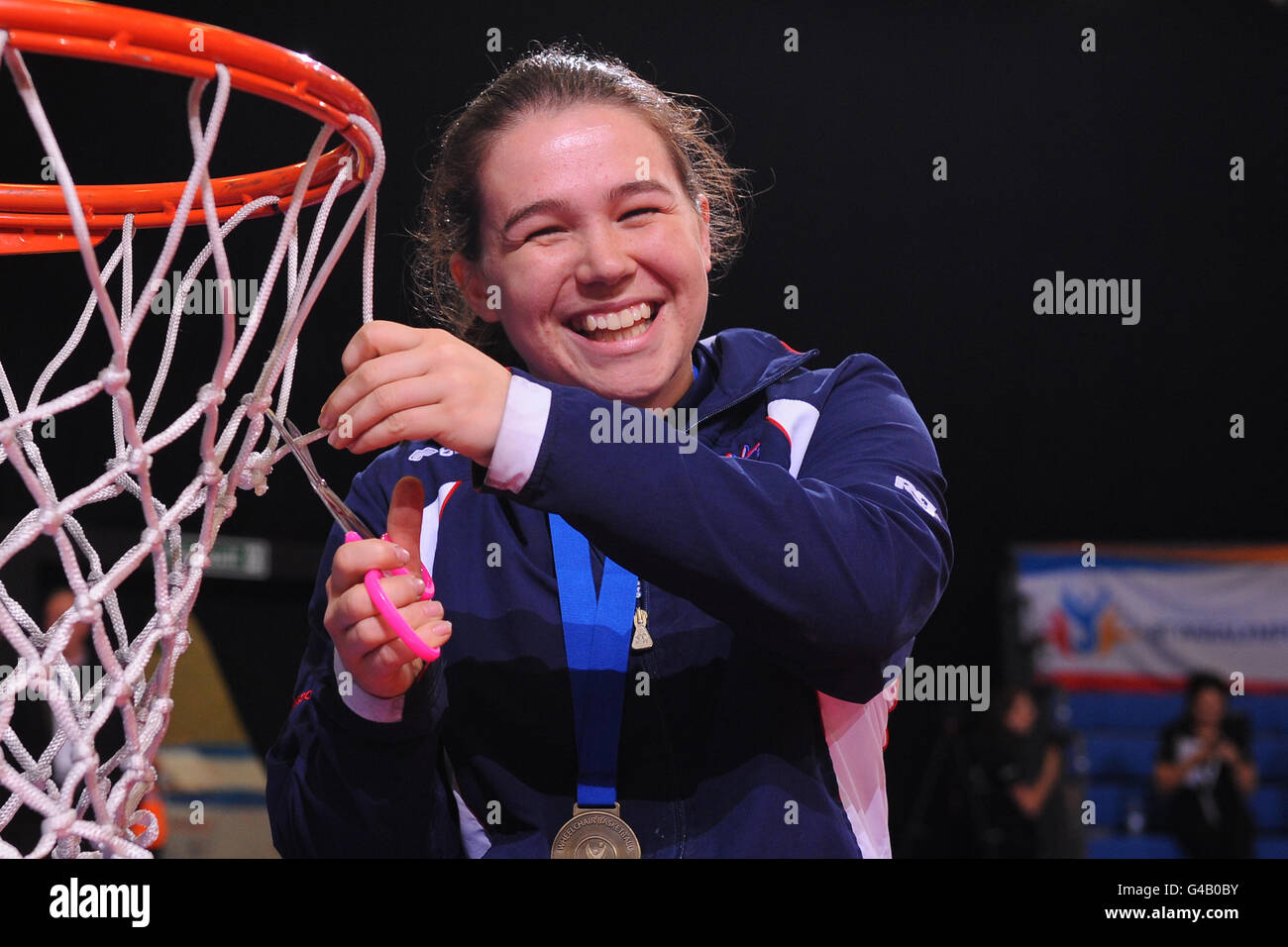 Great Britain's Helen Freeman cuts down the net at the end of the ...