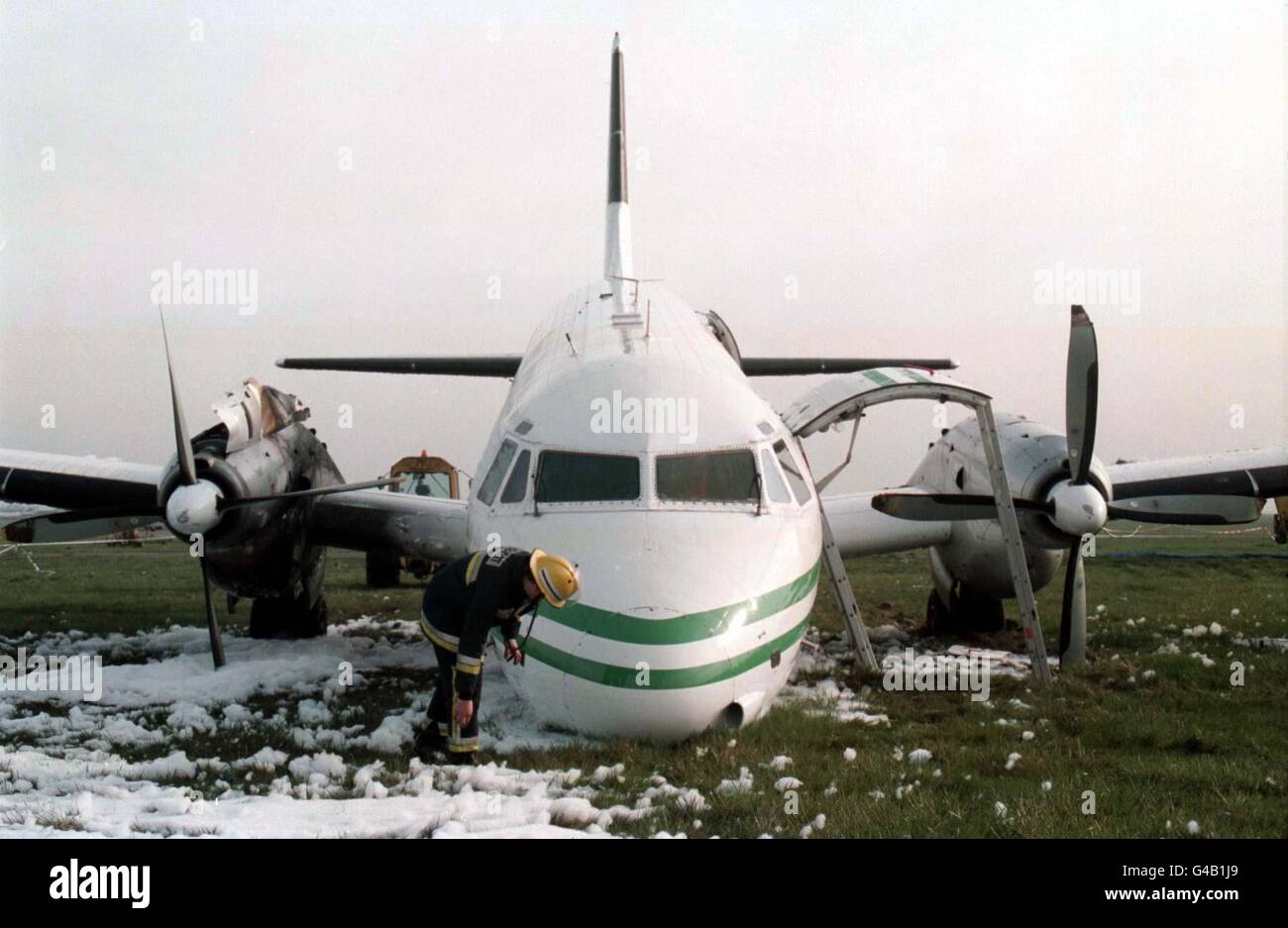 A fireman looks at the wreckage of the Emerald Airways plane at ...