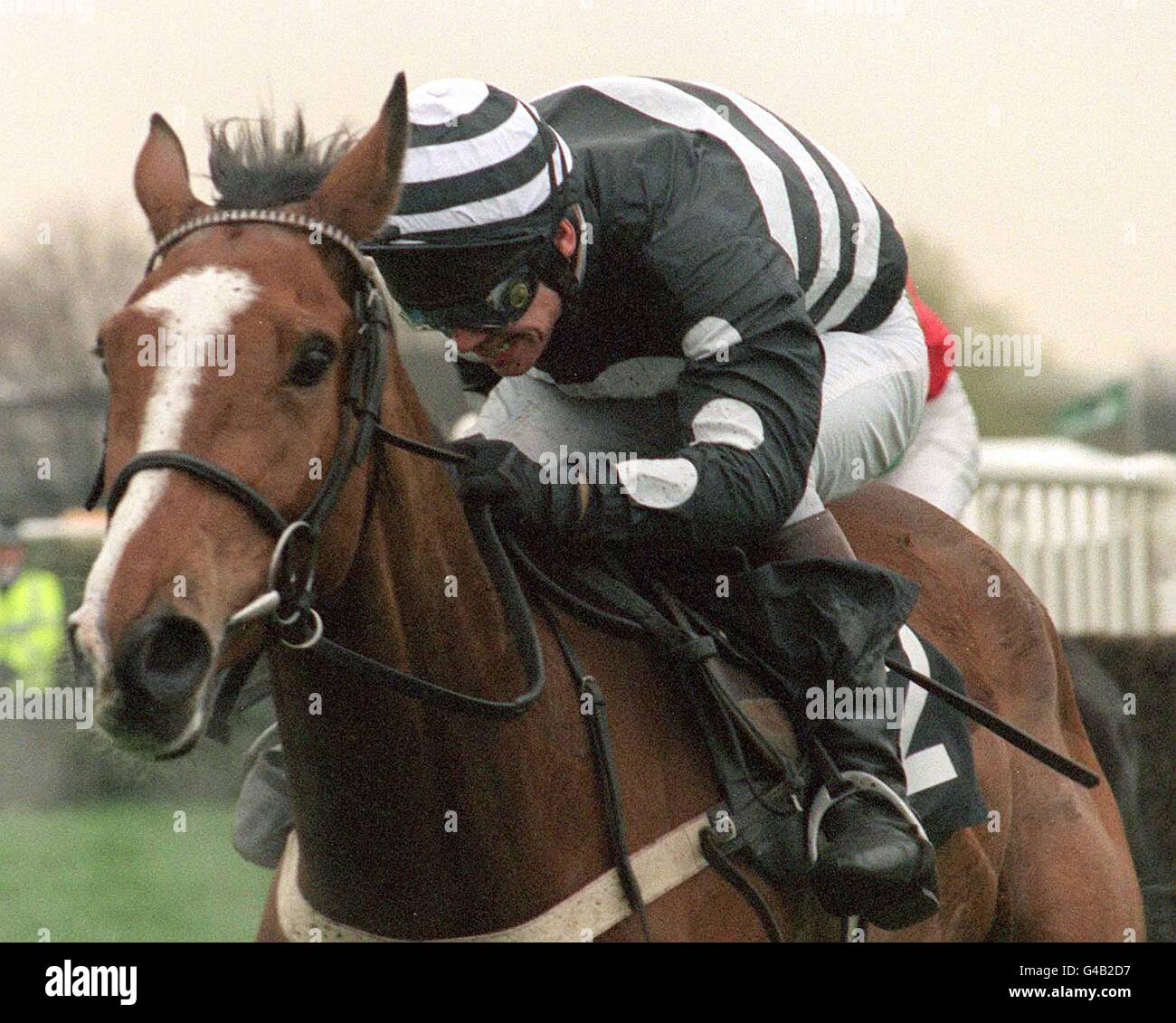 Gritting his teeth and powering to a big race win hi-res stock ...