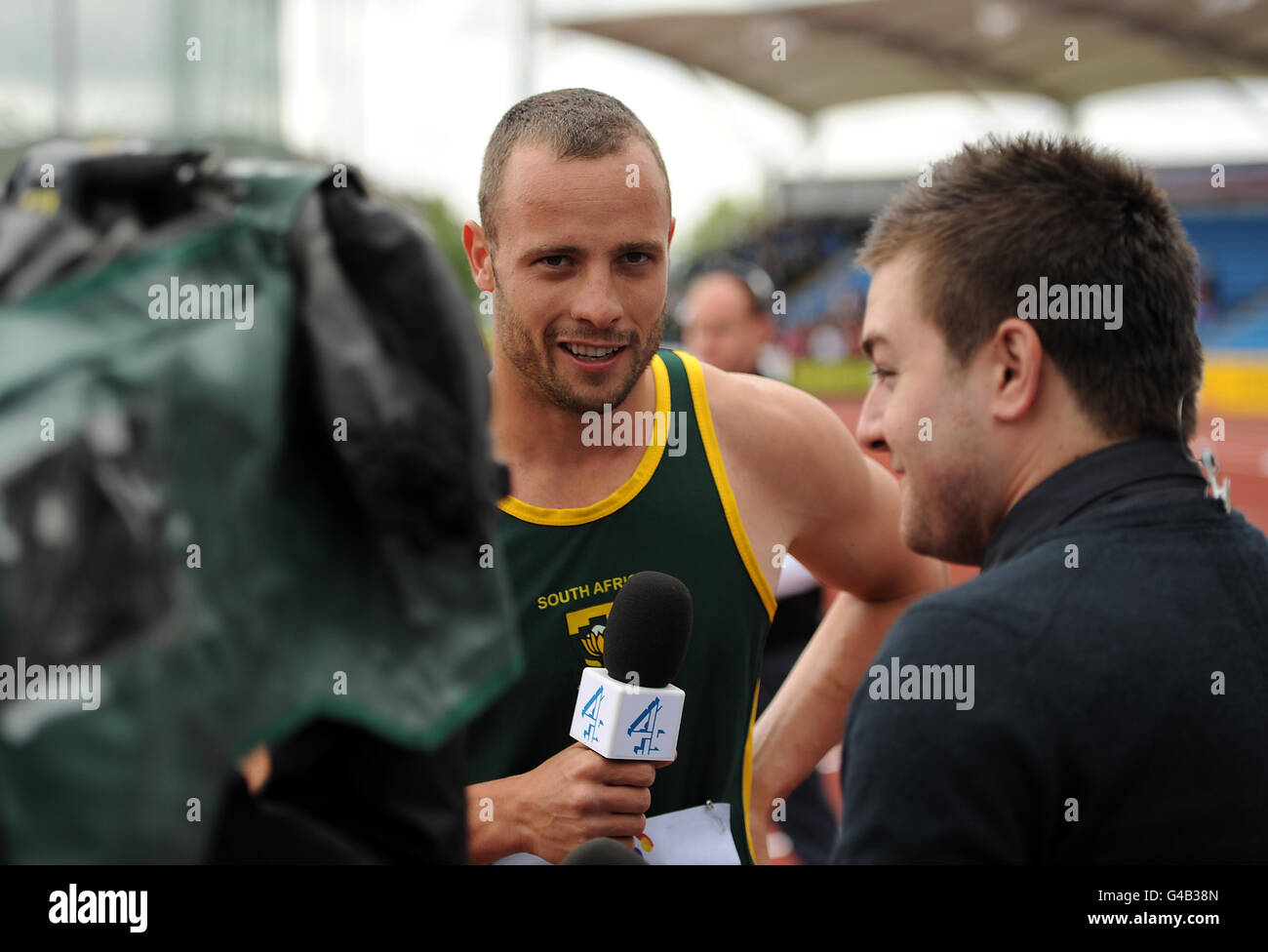 South Africa's Oscar Pistorius (centre) is interviewed by Press ...