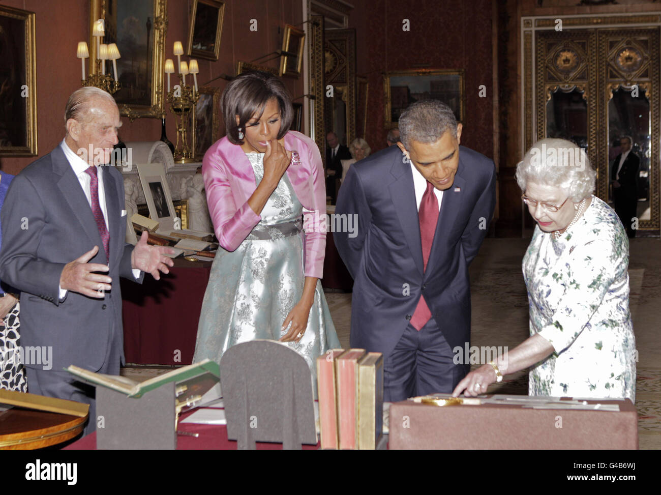 Britain's Queen Elizabeth II, right, shows U.S. President Barack Obama ...