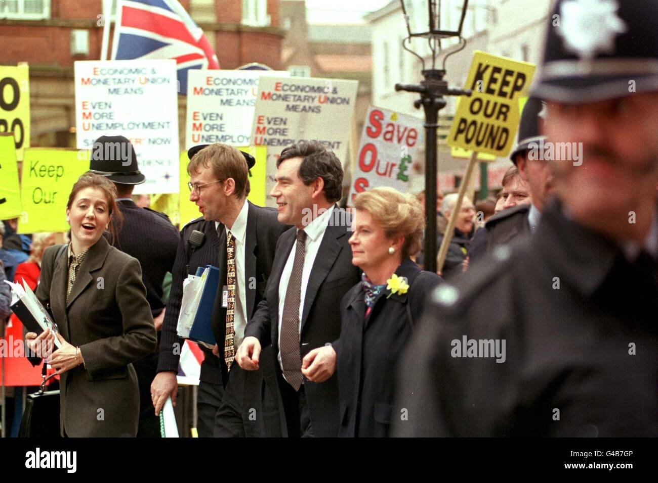 Chancellor Gordon Brown (third from left) maintains a smile as he ...