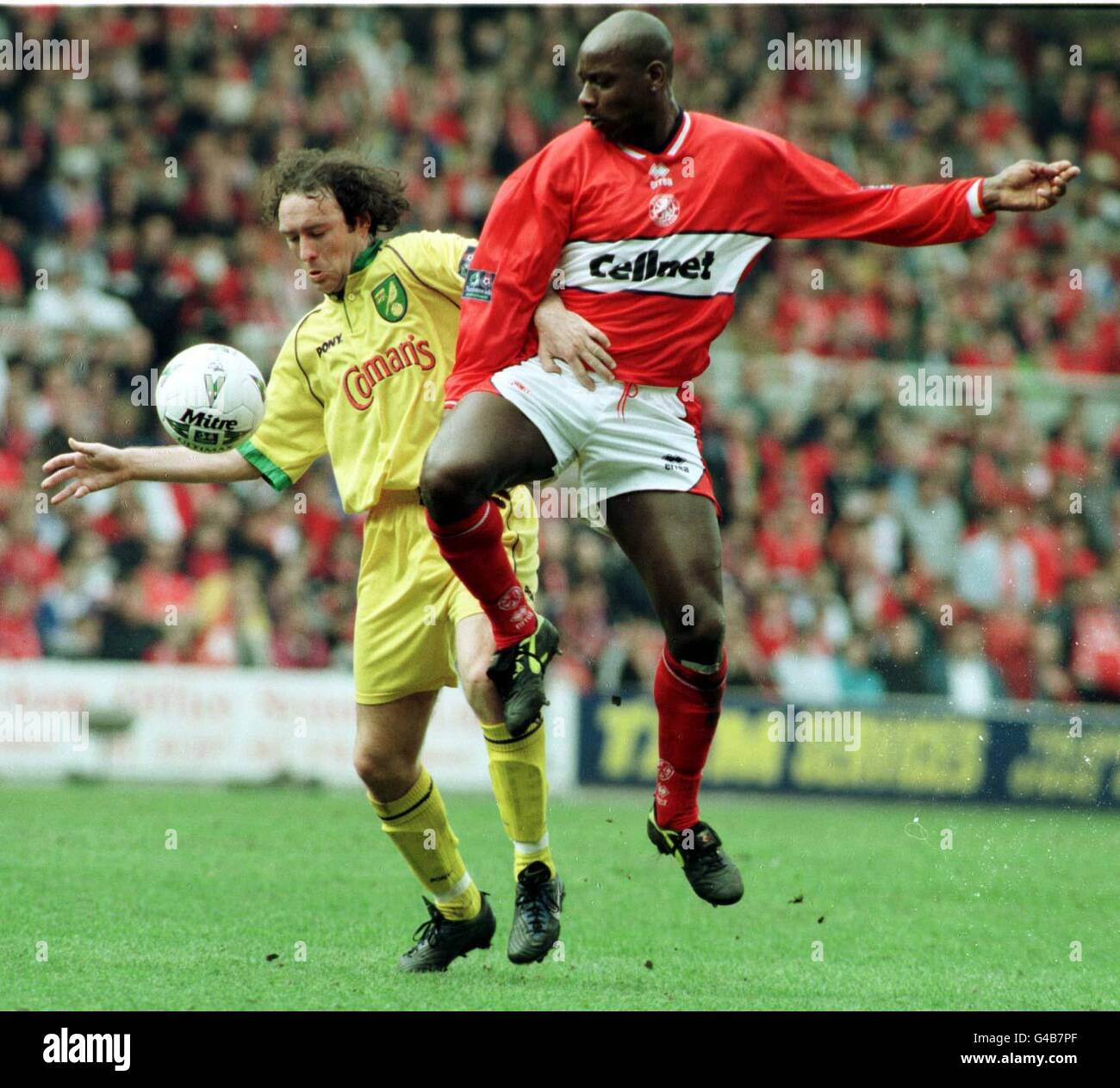 Norwich City's Shaun Carey (left) and Middlesbrough's Michael Thomas ...
