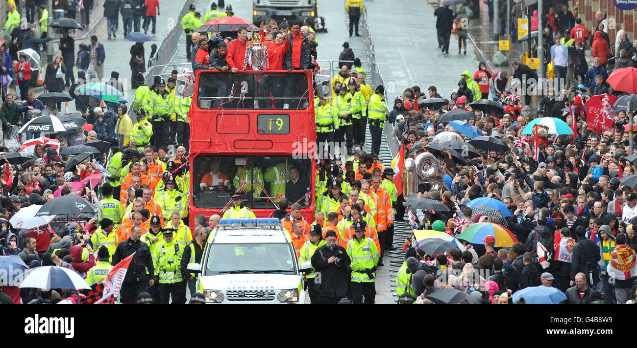 The Manchester United team make their way through the streets on an ...