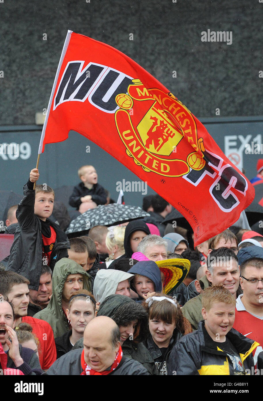 Manchester United fans get ready to watch their team celebrate winning ...