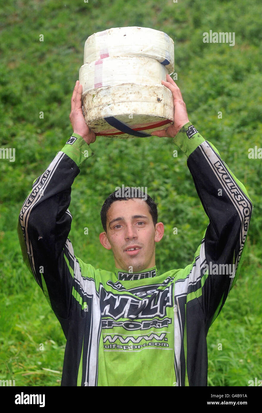 Chris Anderson, 23, from Brockworth holds his prize cheeses after he ...
