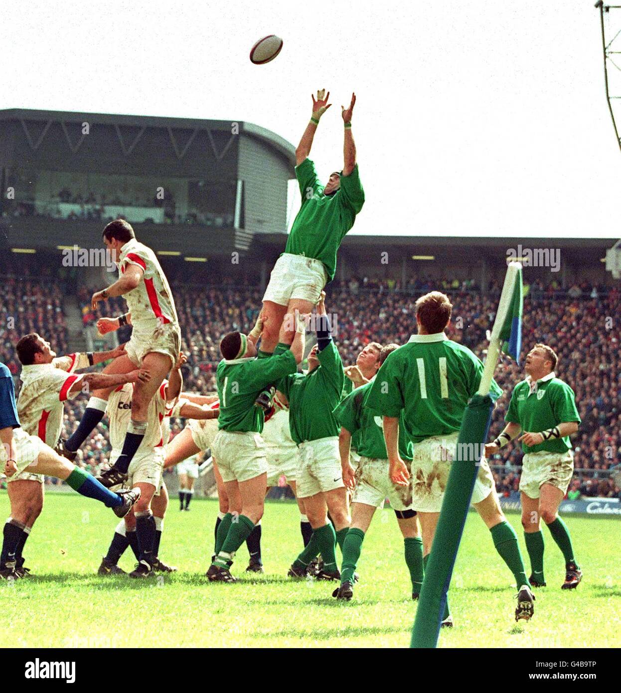 Ireland's Paddy Johns jumps high to take the line out ball during this ...