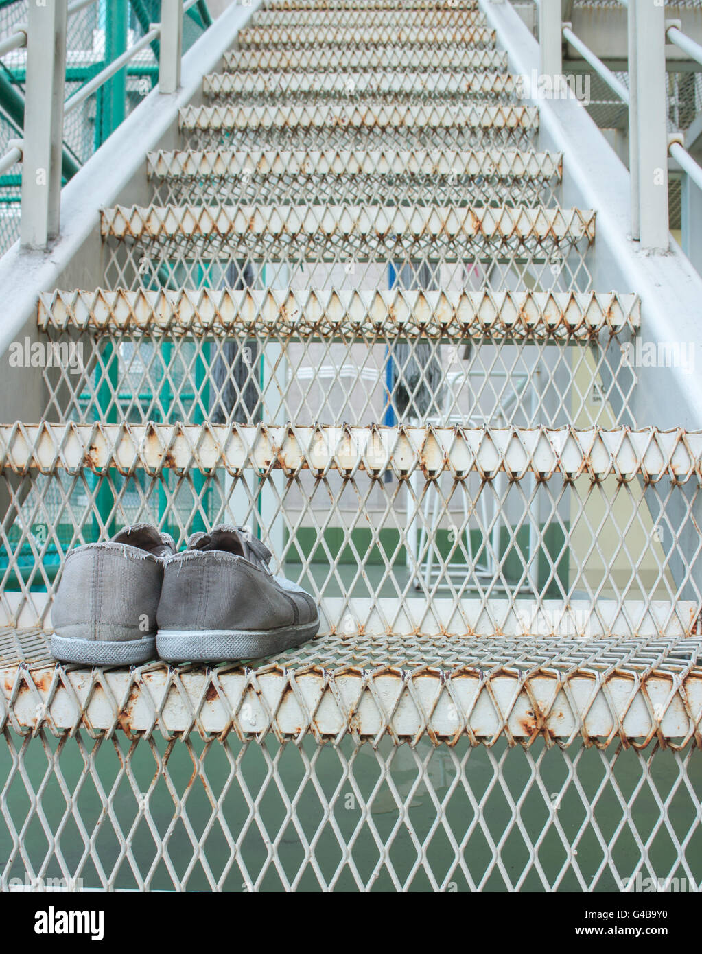 sneakers on the stairs. Making first step Stock Photo - Alamy