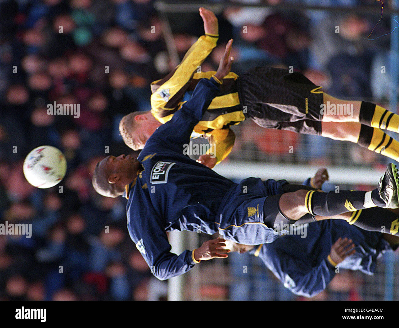 Wimbledon's Marcus Gayle (left) and Everton's Michael Ball rise for the ...
