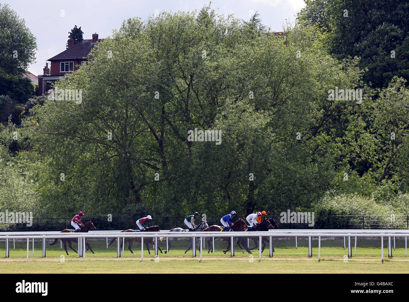 General view of runners and riders as they make their way around ...