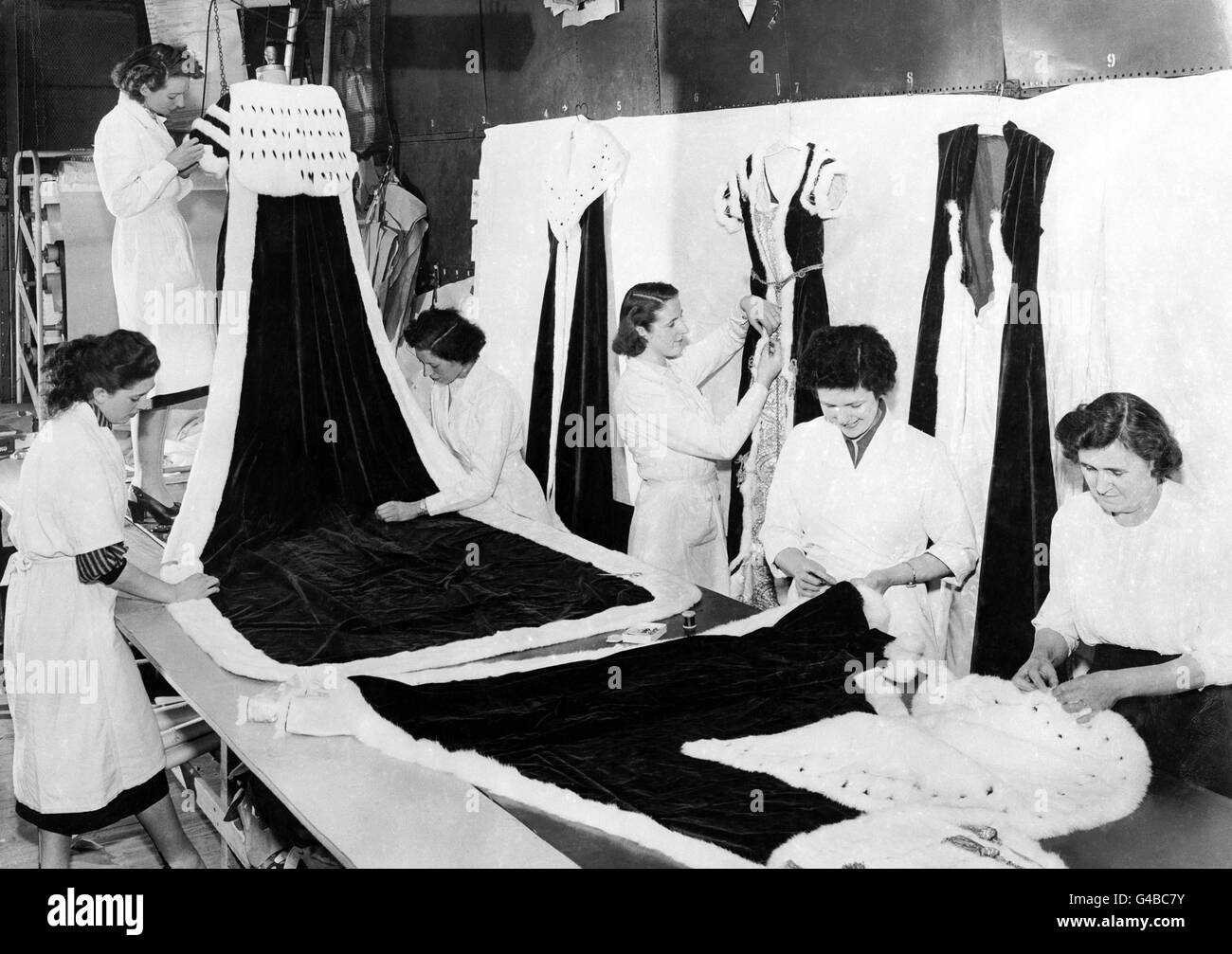 A scene of high pressure, as women complete peeresses' Coronation robes ...
