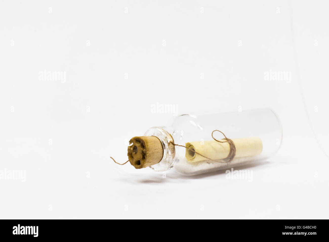 Message in bottle isolated on white background Stock Photo - Alamy