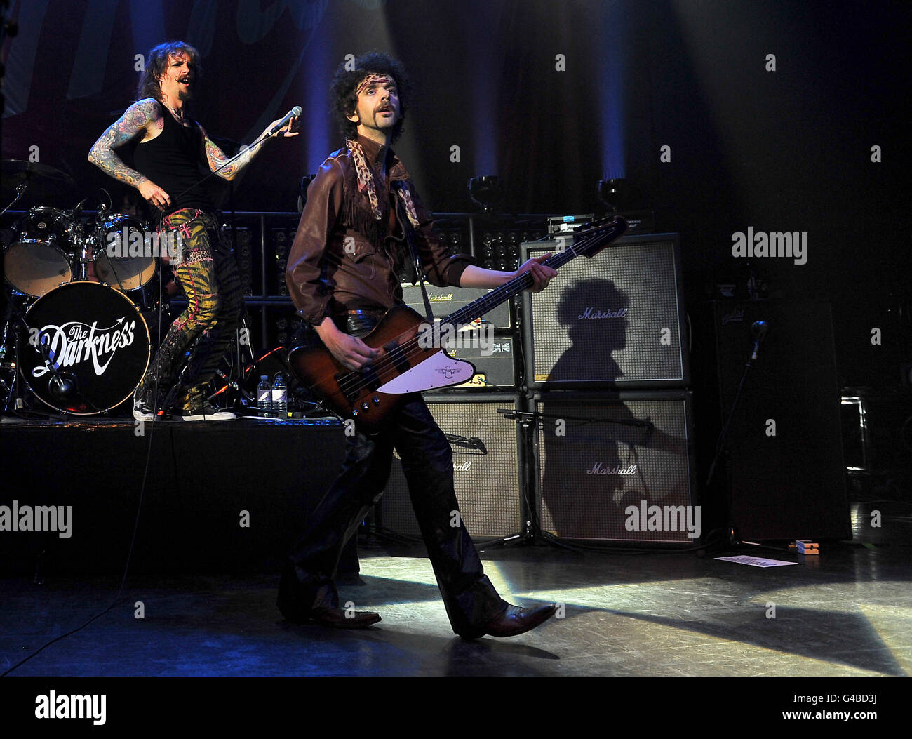 Justin Hawkins (left) and Frankie Poullain of The Darkness perform on ...