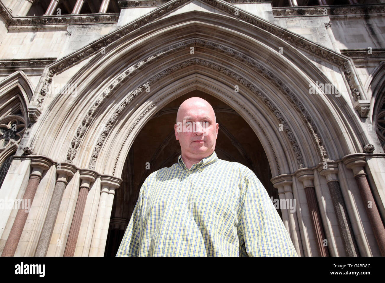 Mark Neary, of Uxbridge, north west London, stands outside the High ...