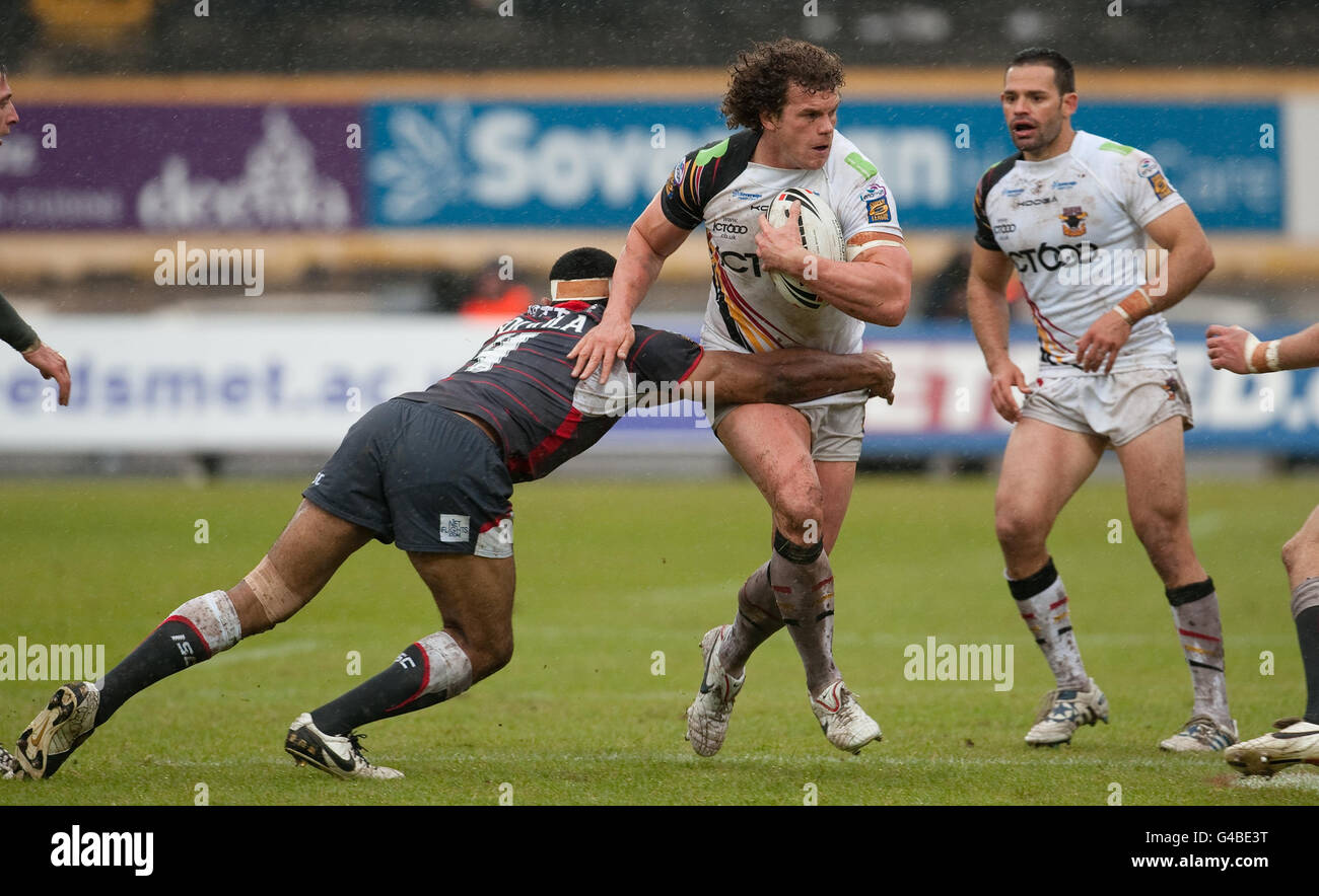 Bradford's Jamie Langley gets past St Helens's Iosia Soliola during the ...