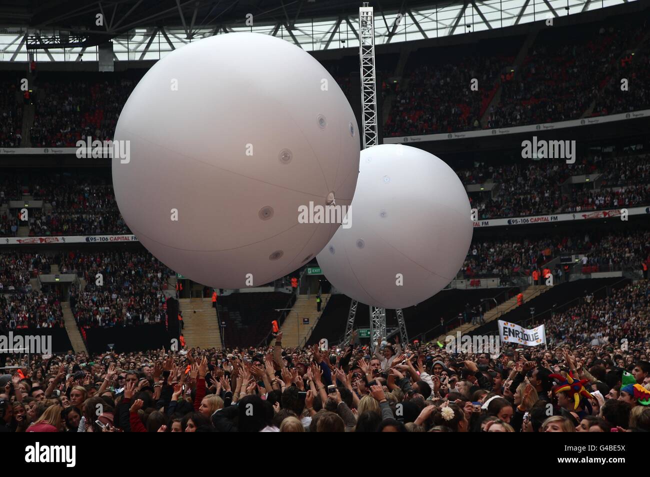 Giant inflatable balls are passed around the crowd during Capital FM's ...