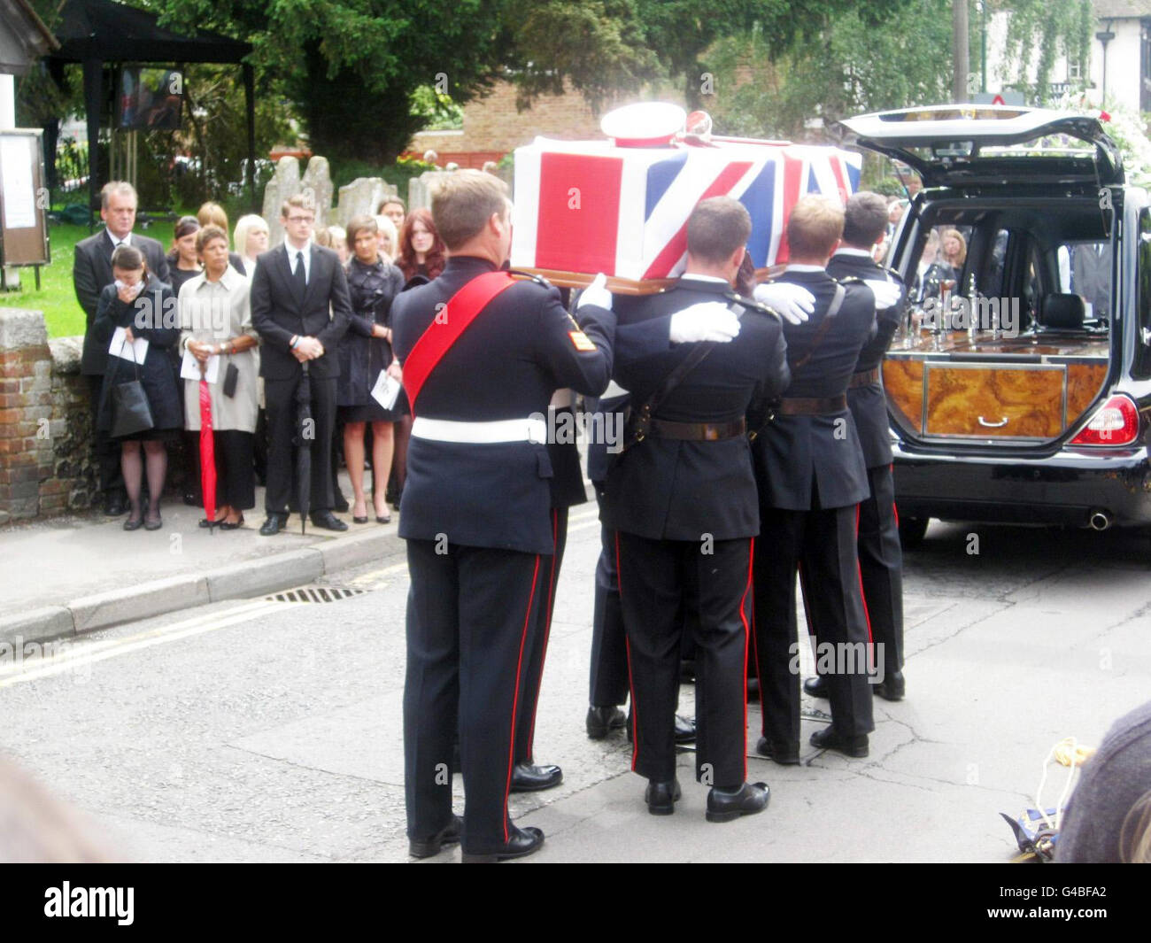 The coffin of Lieutenant Ollie Augustin of 42 Commando Royal Marines is ...