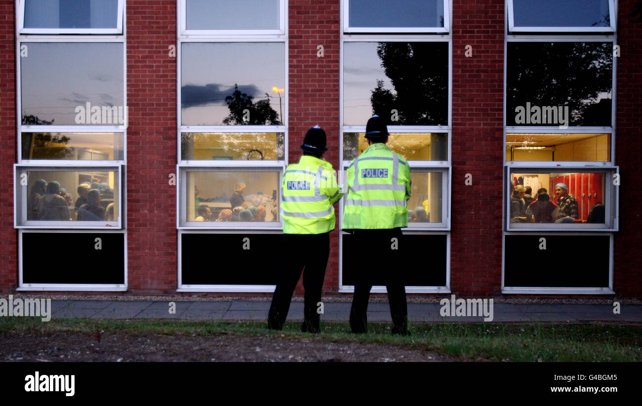 Police officers outside Honeytop Foods in Dunstable, Bedfordshire as ...