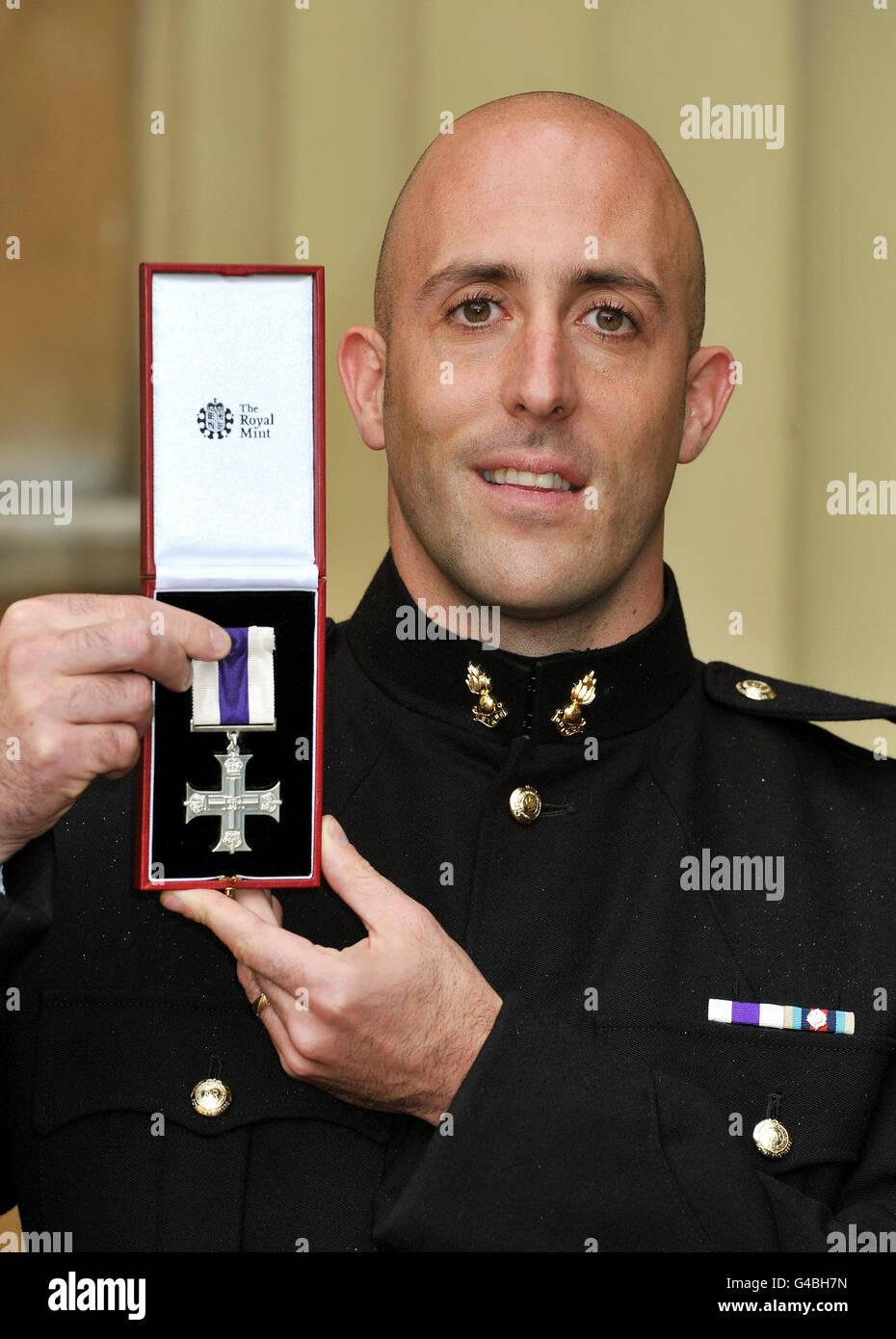 Corporal James Bedford of the Royal Engineers proudly holds his ...