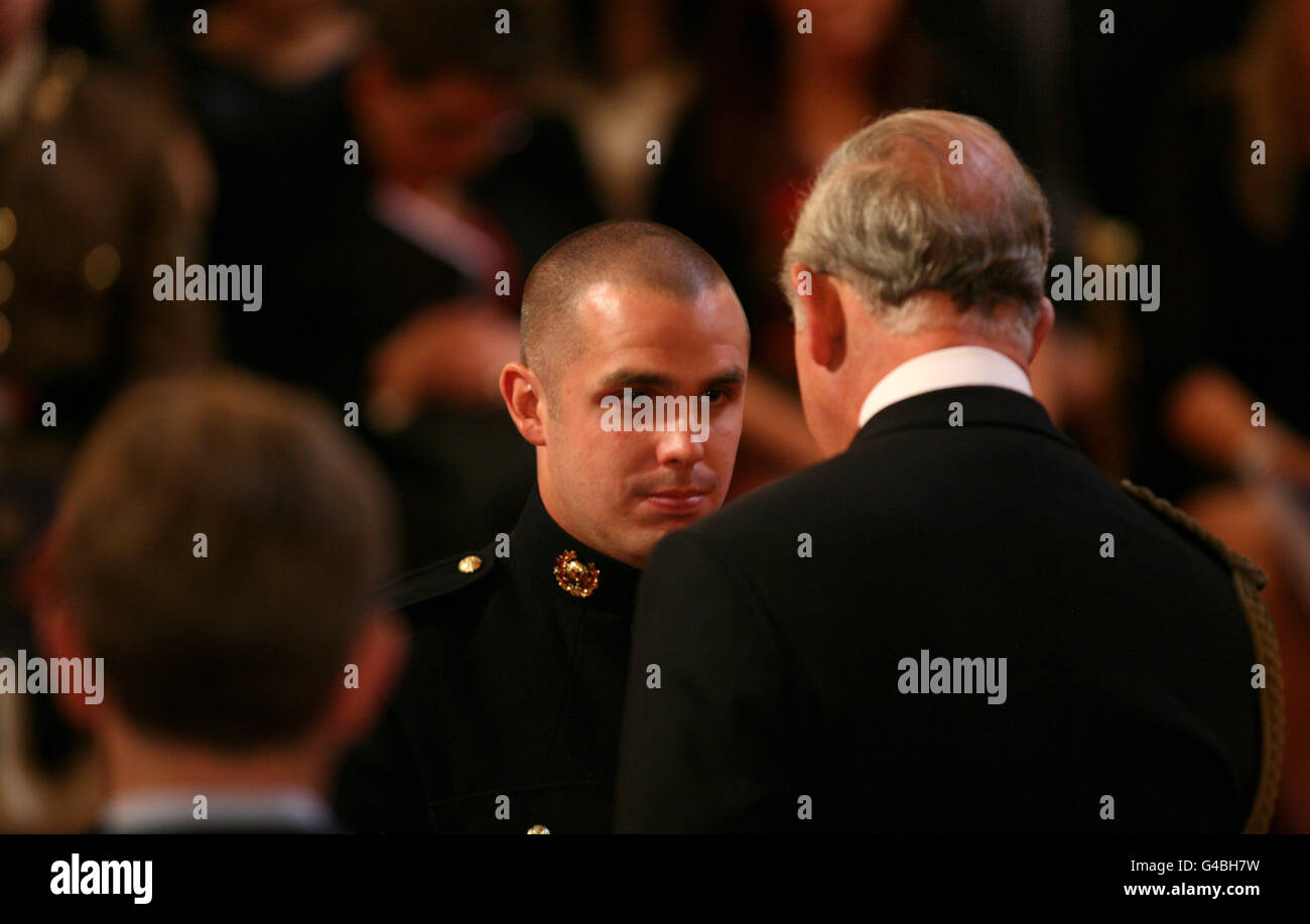 Lance Corporal Ryan Shelley, Royal Marines, is decorated with the ...