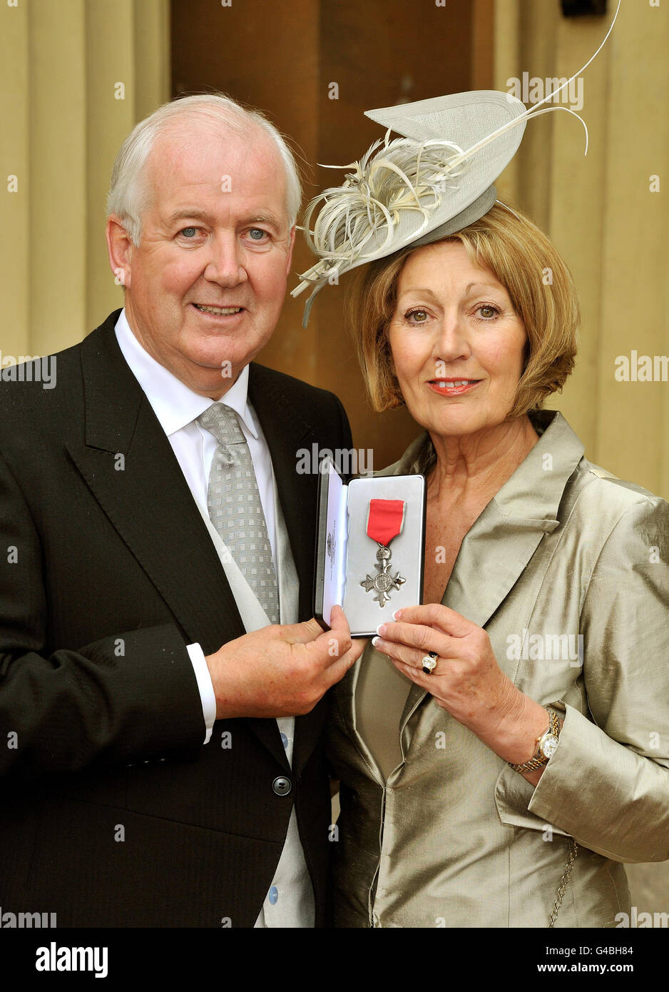 John Moore with his wife Norma proudly hold his MBE after it was ...