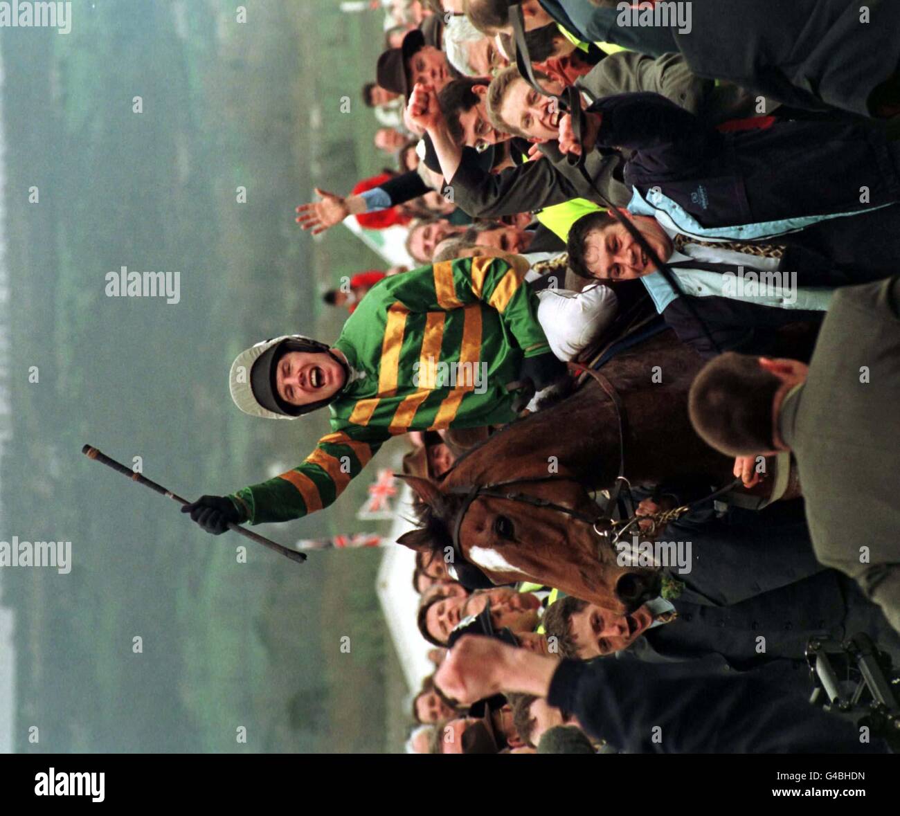 Charlie Swan celebrates as he is led in on the Smurfit Champion Hurdle ...