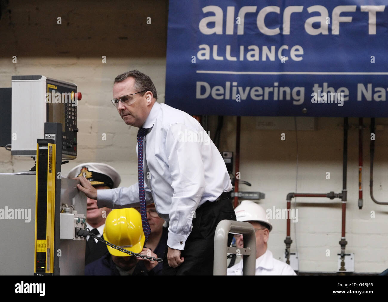 Defence secretary liam fox cuts first steel new aircraft carrier hi-res ...